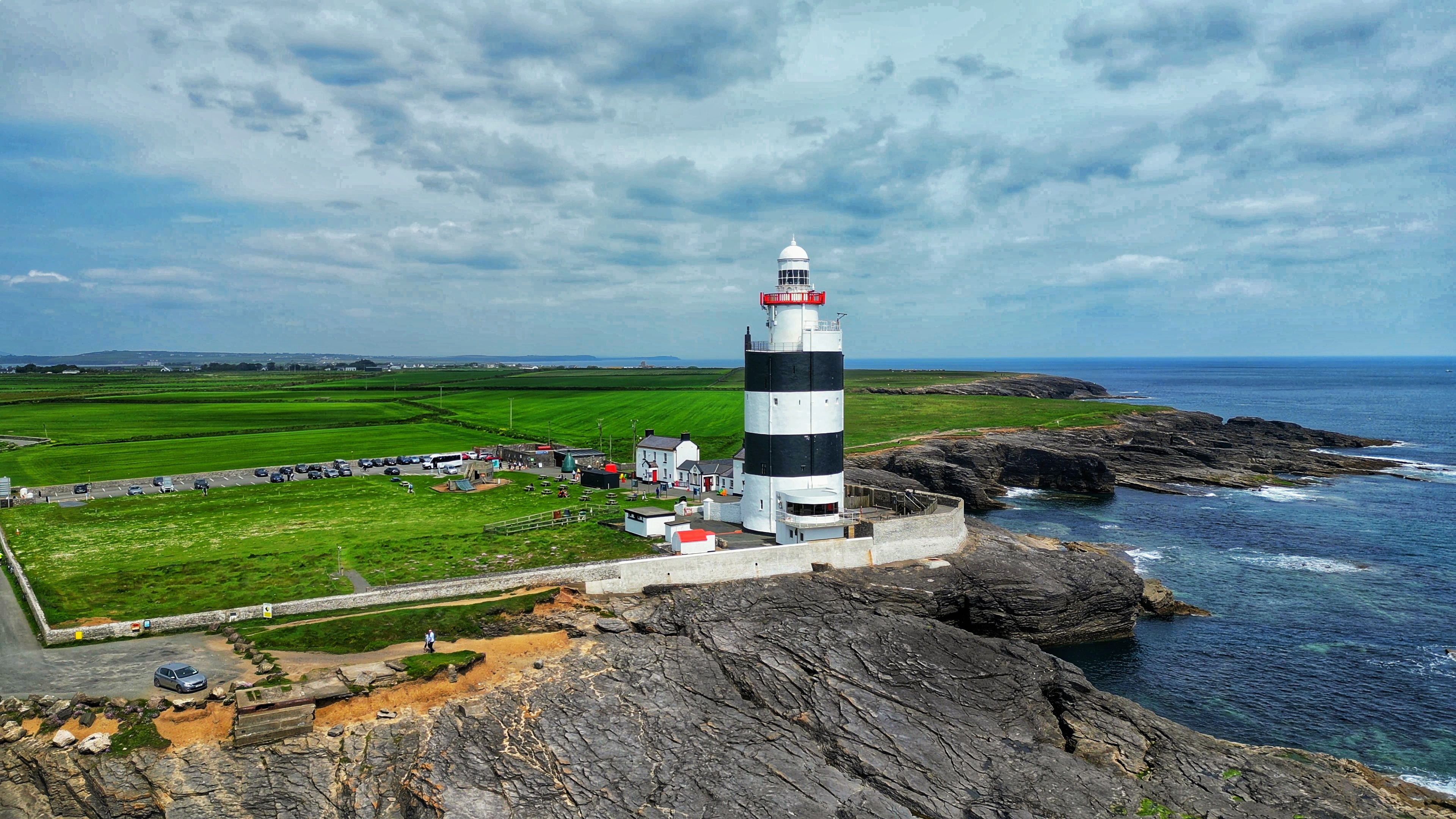 Hook Lighthouse on Sea Shore in Ireland · Free Stock Photo