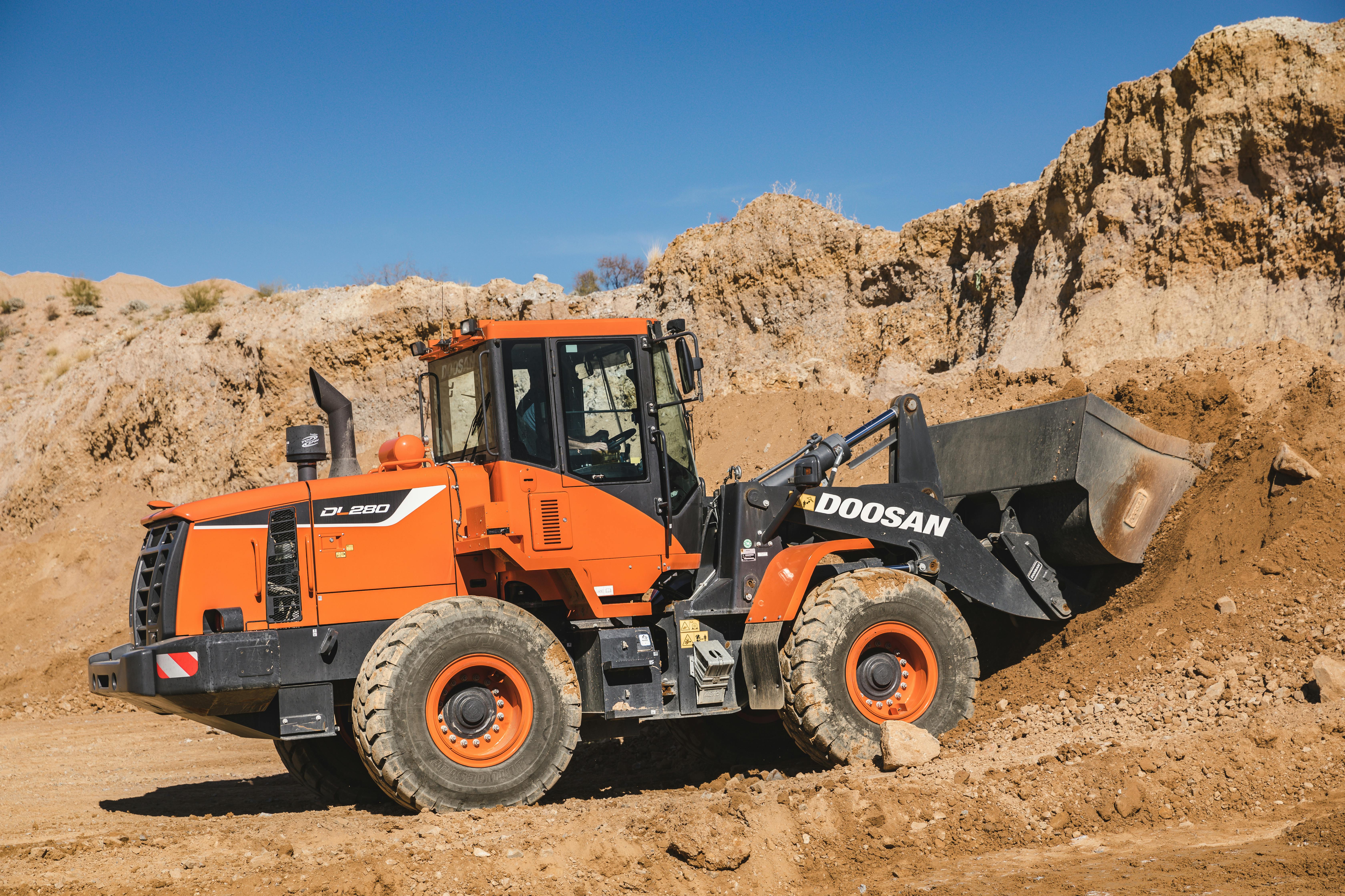 Excavator under Sand Mound · Free Stock Photo