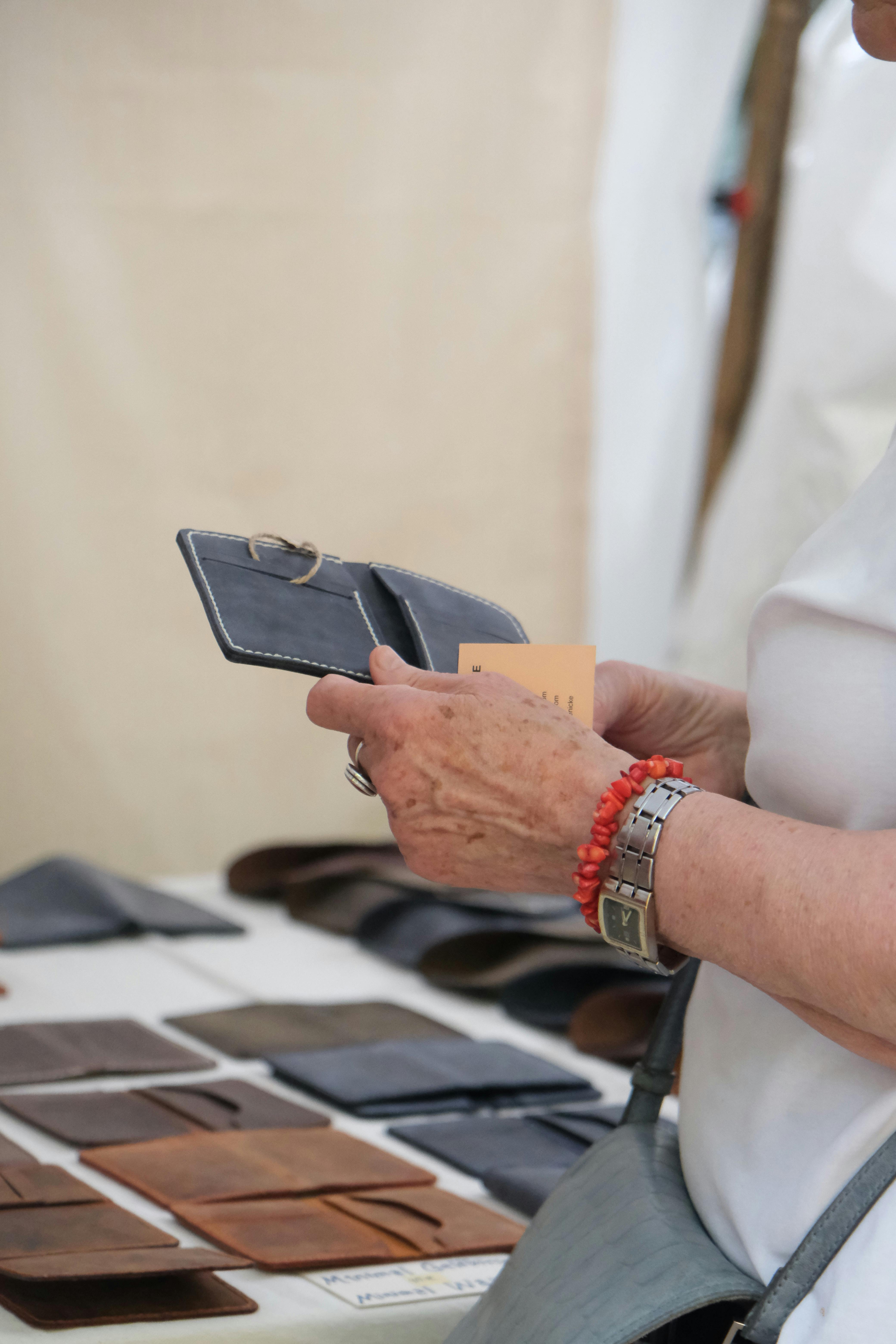 Person Holding Wallet · Free Stock Photo