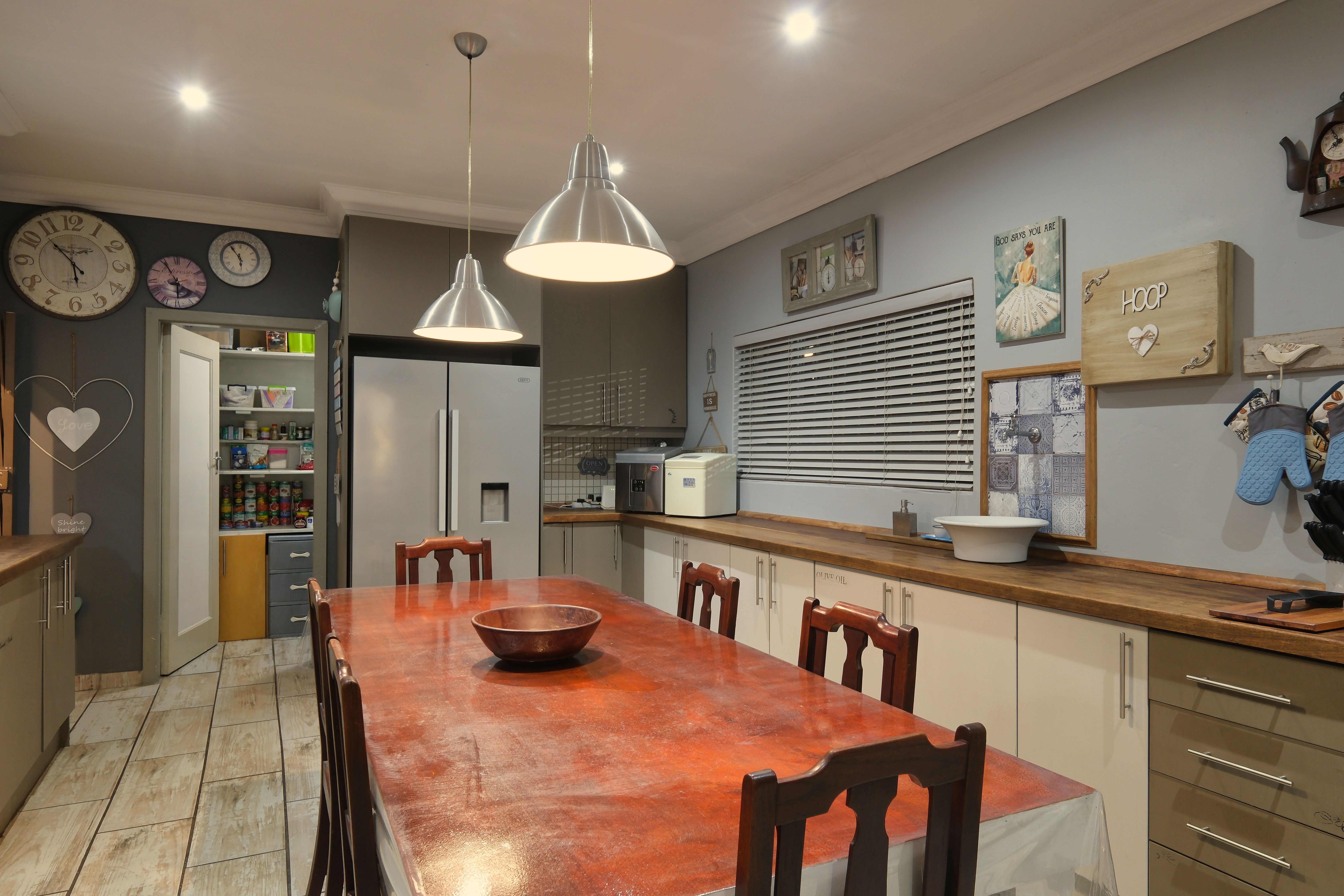 Interior of a Modern Kitchen with a Table in the Middle · Free Stock Photo