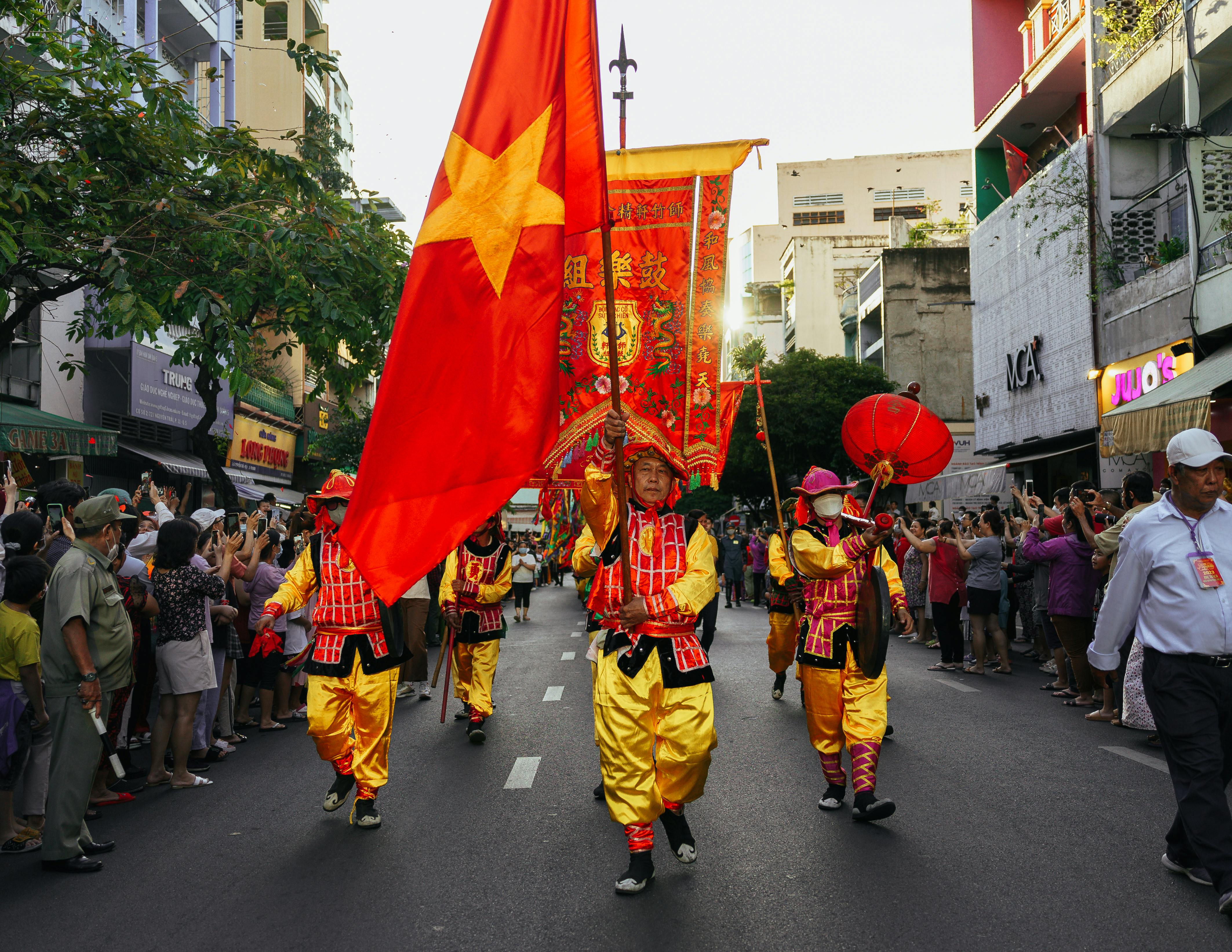 Parade with Large Vietnamese Flag on Street · Free Stock Photo