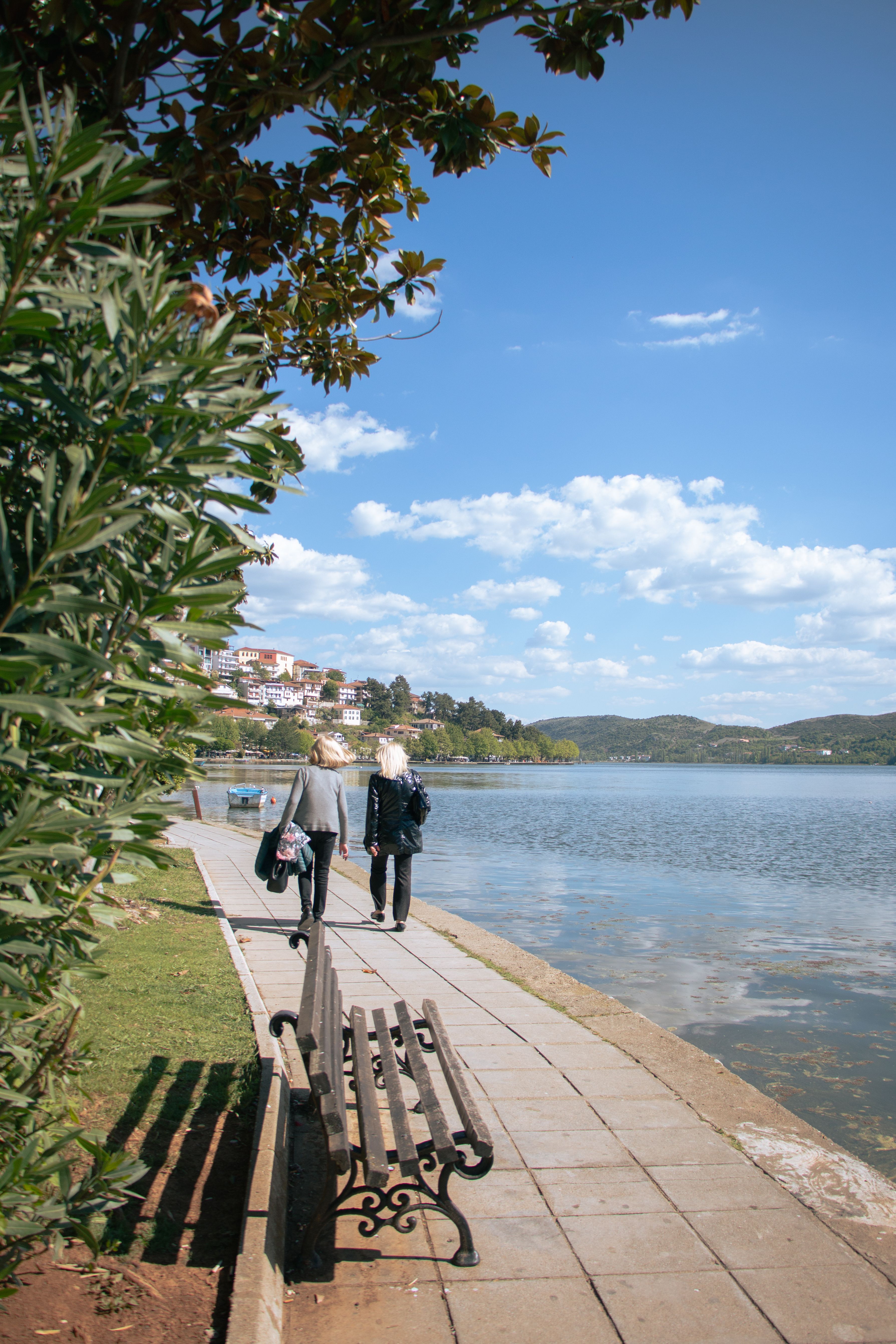 People on a Pathway by a Lake · Free Stock Photo