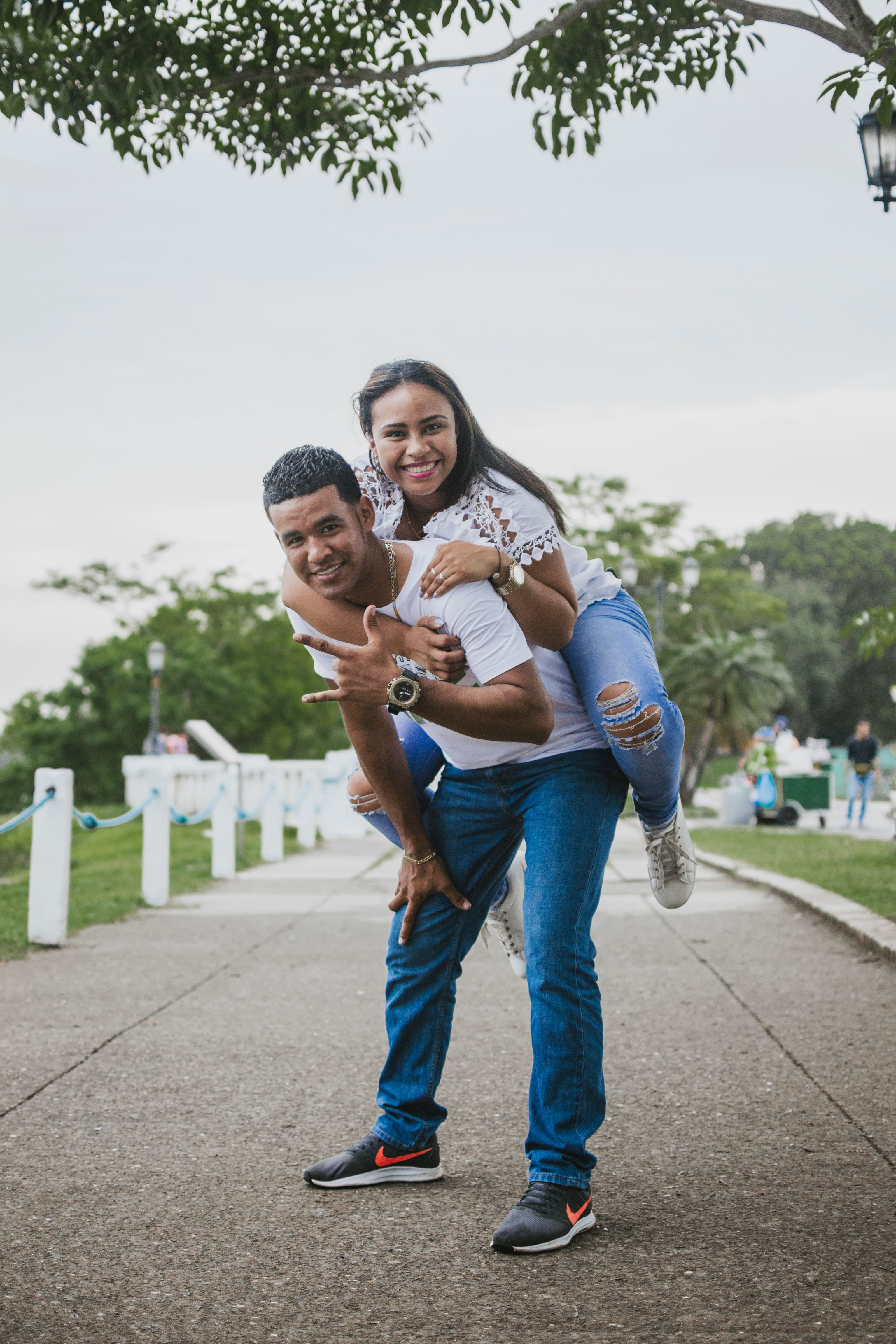 Man Carrying Piggyback Woman · Free Stock Photo