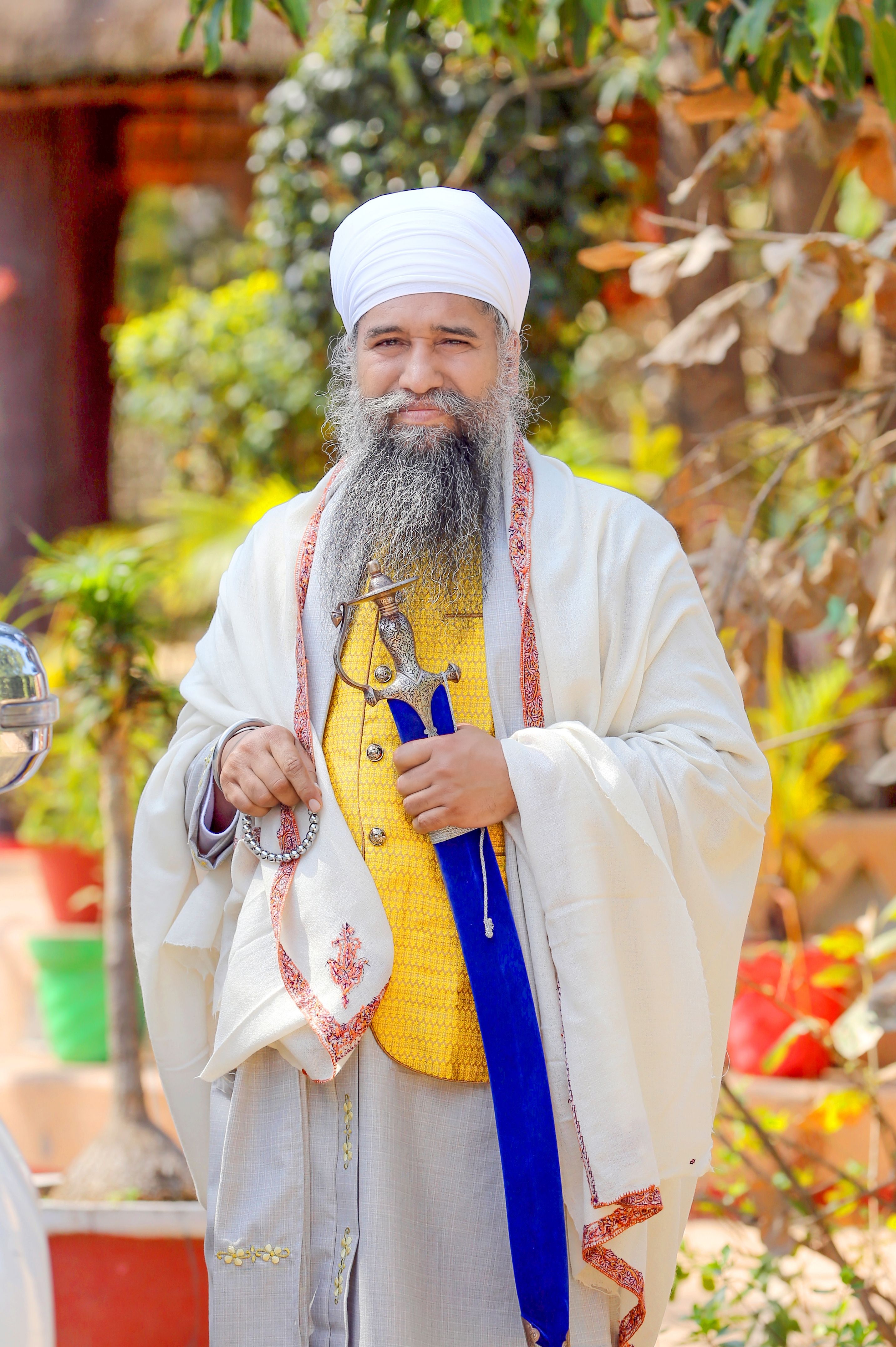 Portrait of a Bearded Man Holding a Sheathed Sword and Prayer Beads ...