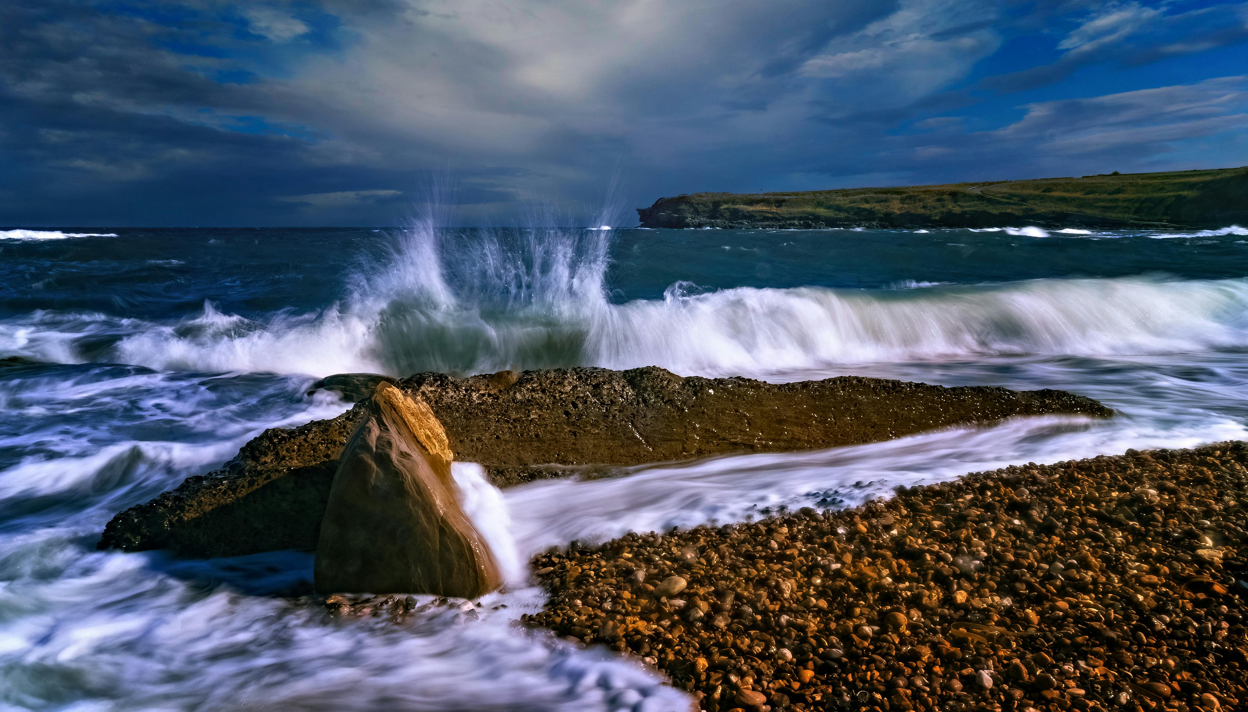 Sea Waves Breaking against a Rock on a Beach · Free Stock Photo