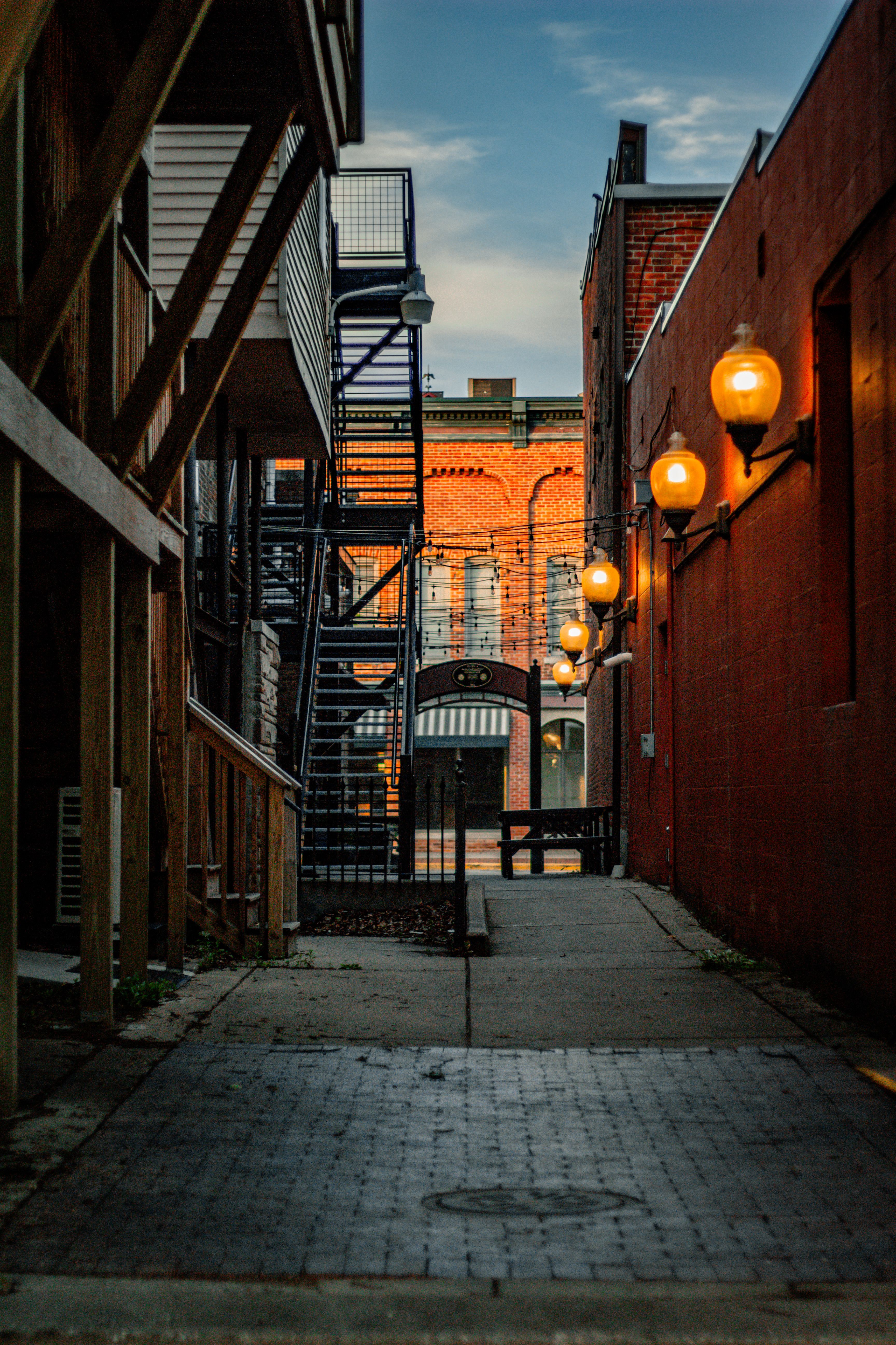 Narrow Alley with Fire Stairs and Lamps · Free Stock Photo