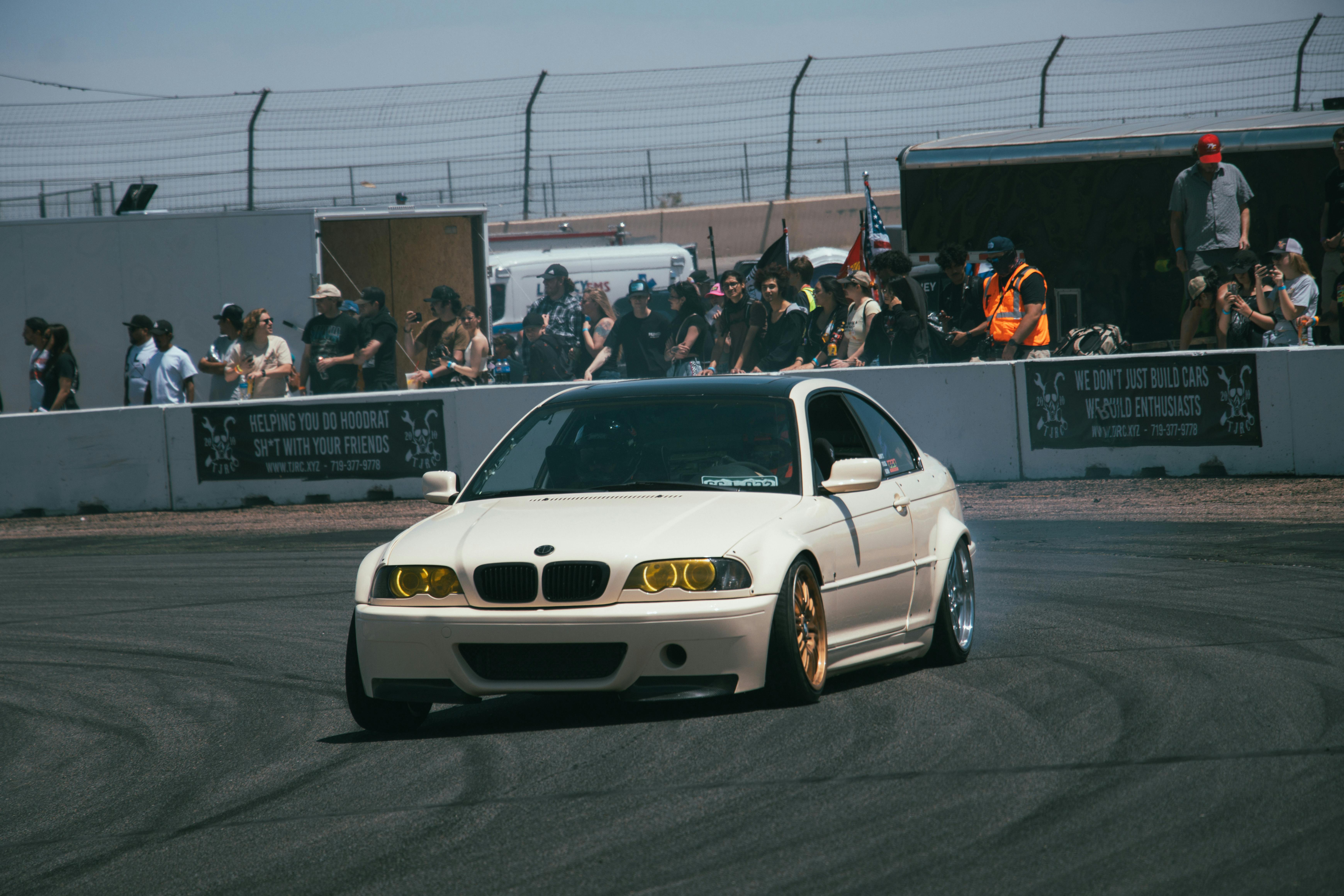 BMW Car Performing Drift at Racing Event · Free Stock Photo