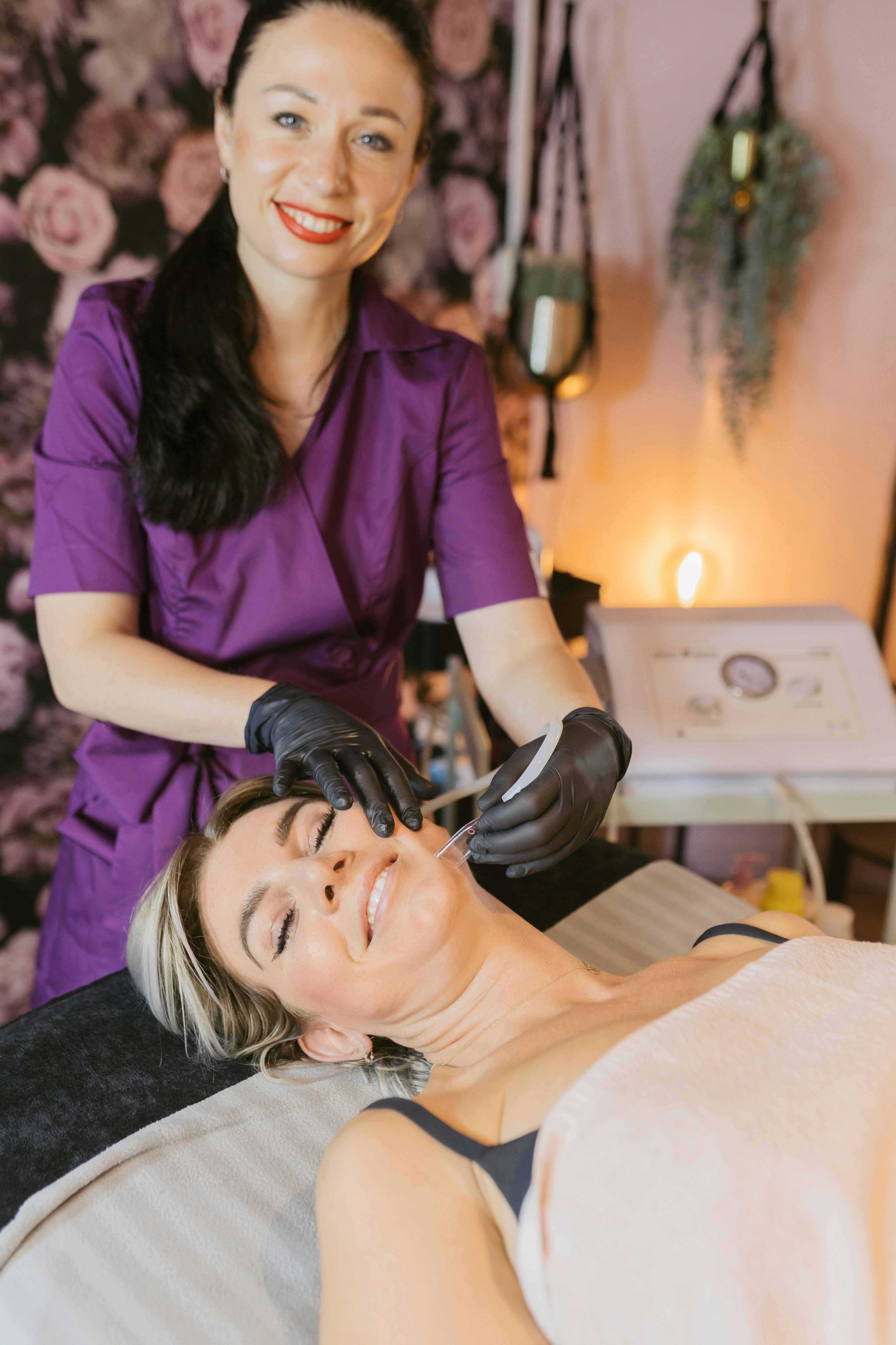 Beautician Making Facial Beauty Procedures for Woman in Salon · Free ...