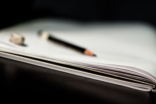 Man Writing in a Book · Free Stock Photo