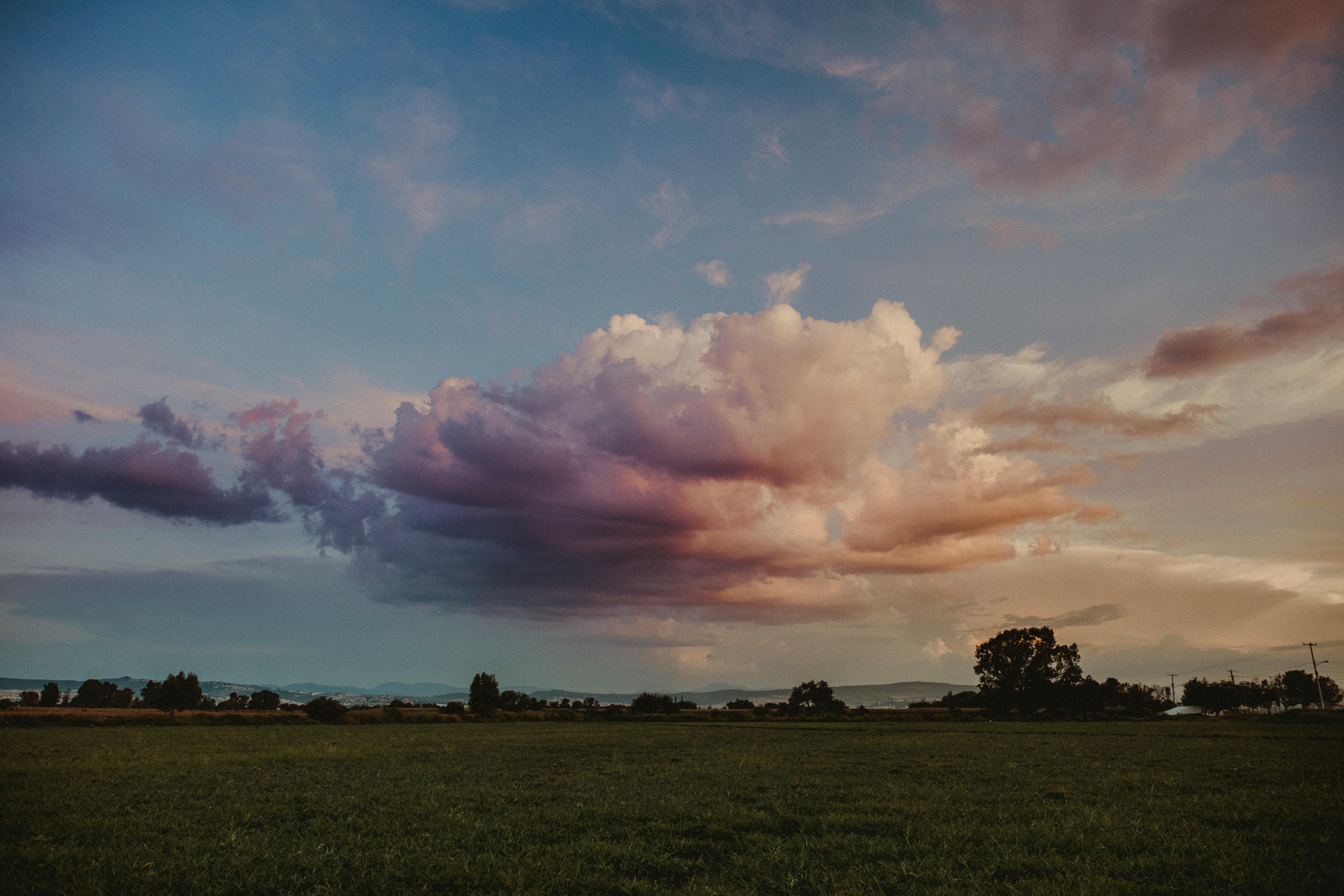 Dramatic Clouds Above A Farmland · Free Stock Photo