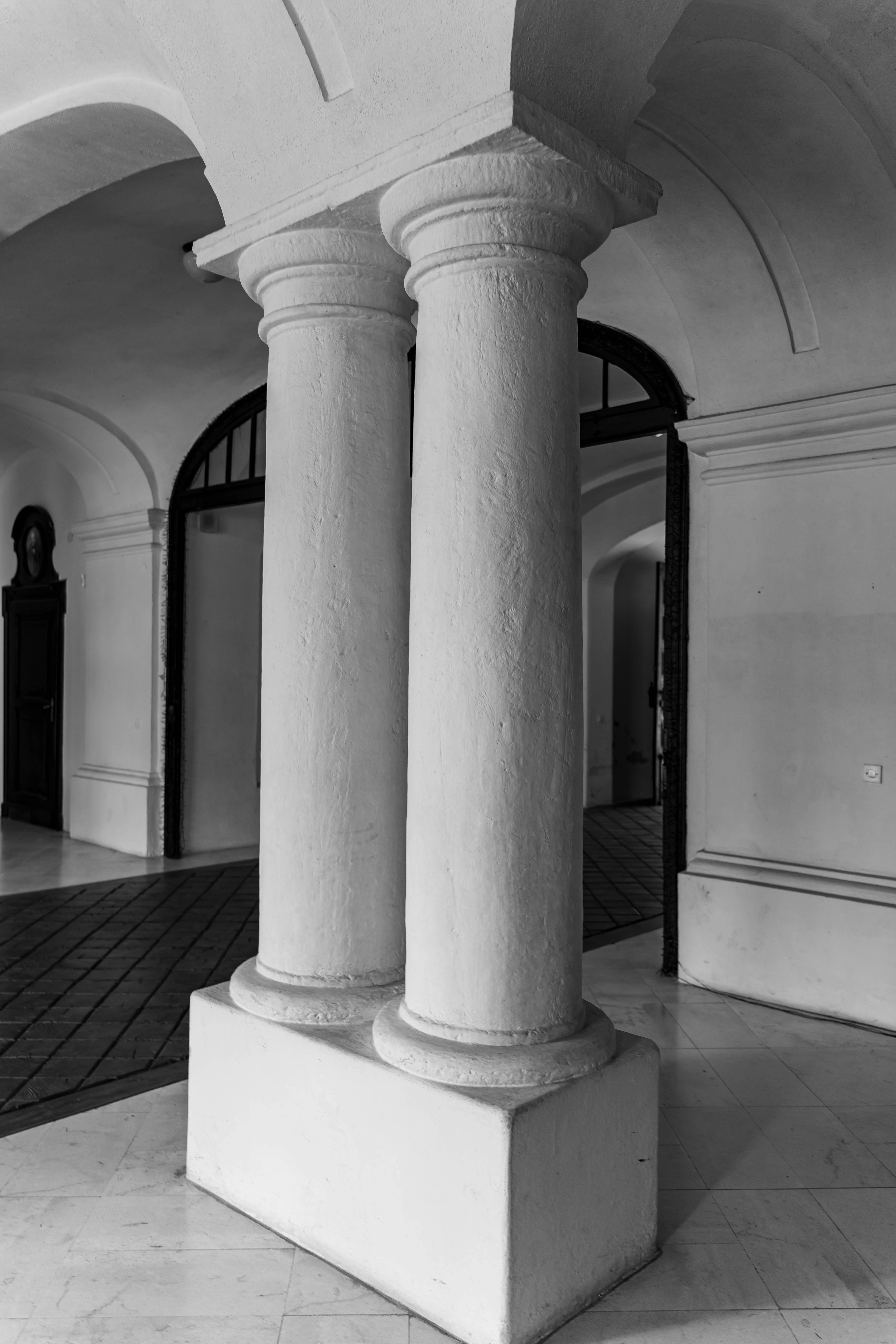 A black and white photo of two pillars · Free Stock Photo