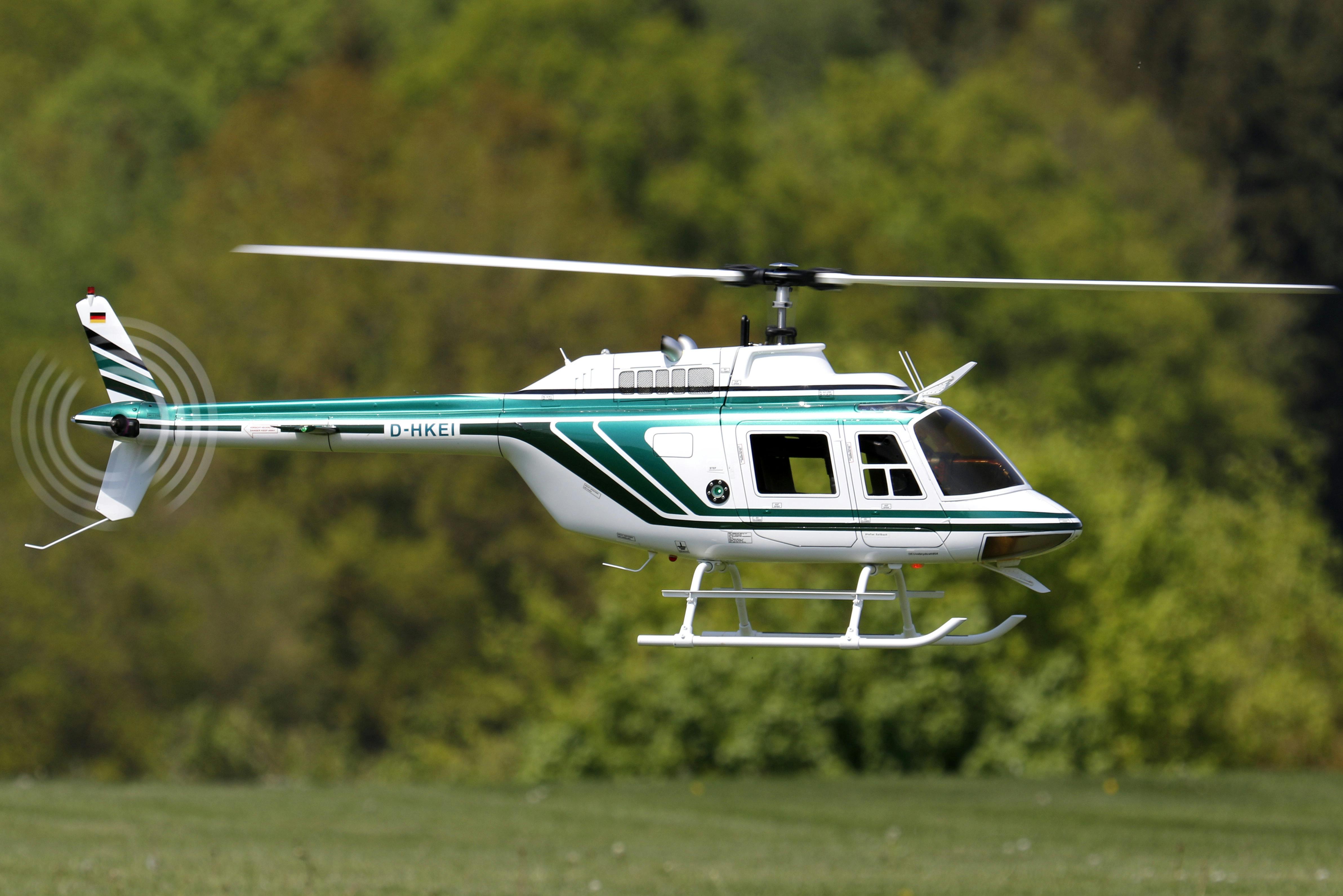 White RC Helicopter Flying Outdoors · Free Stock Photo