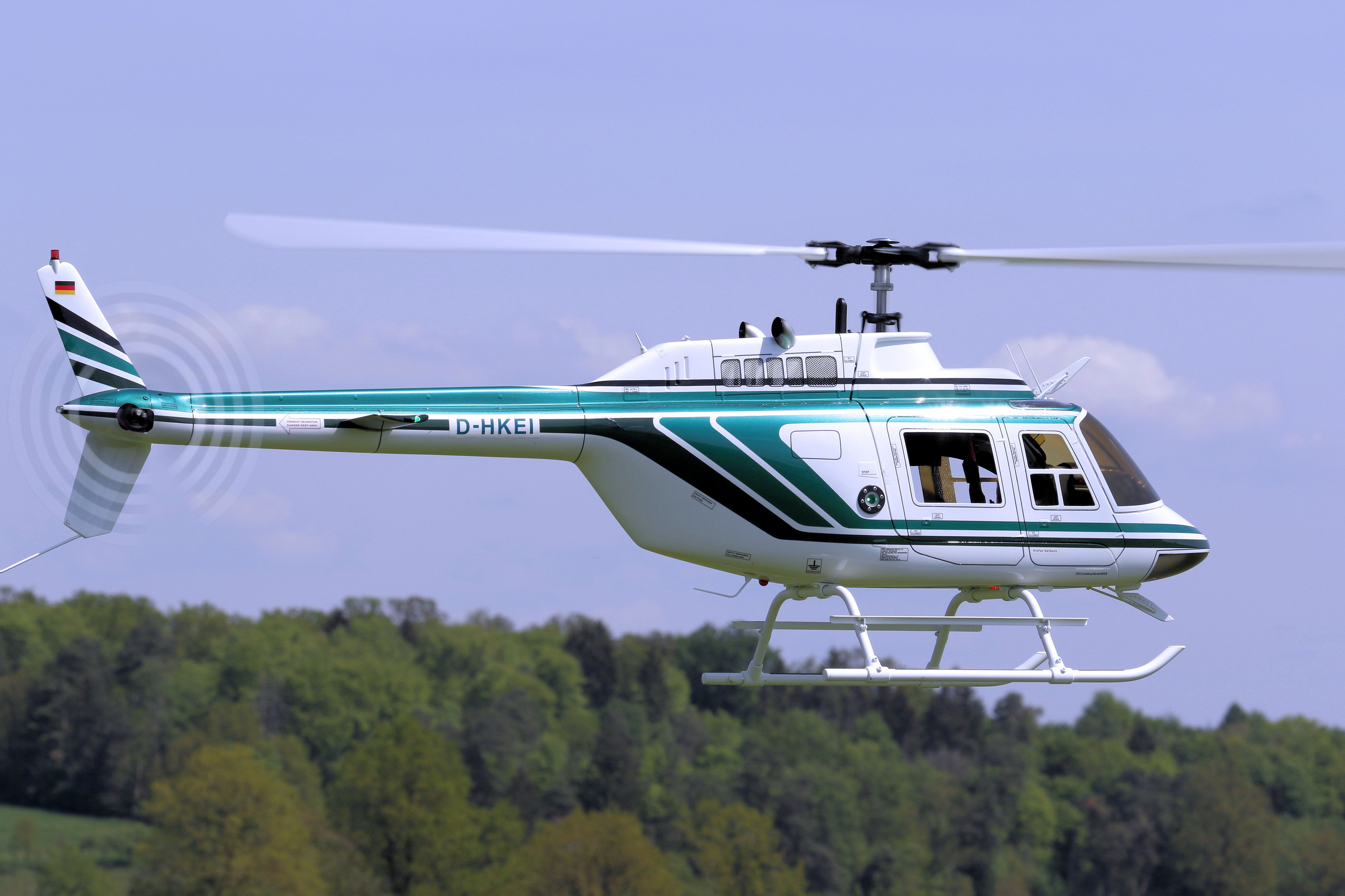 Helicopter Flying against Trees · Free Stock Photo
