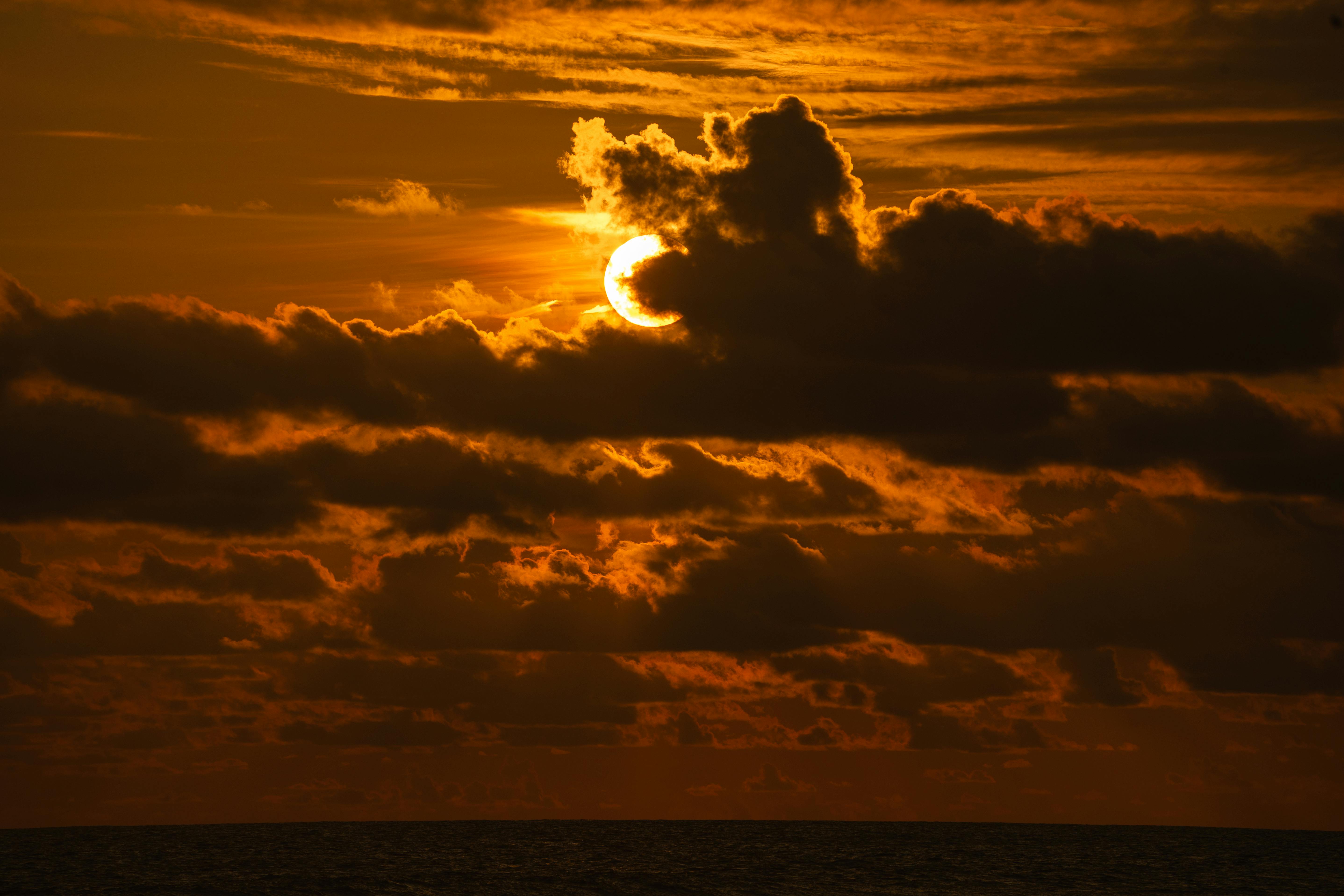 Clouds in Yellow Sky over Sea at Sunset · Free Stock Photo