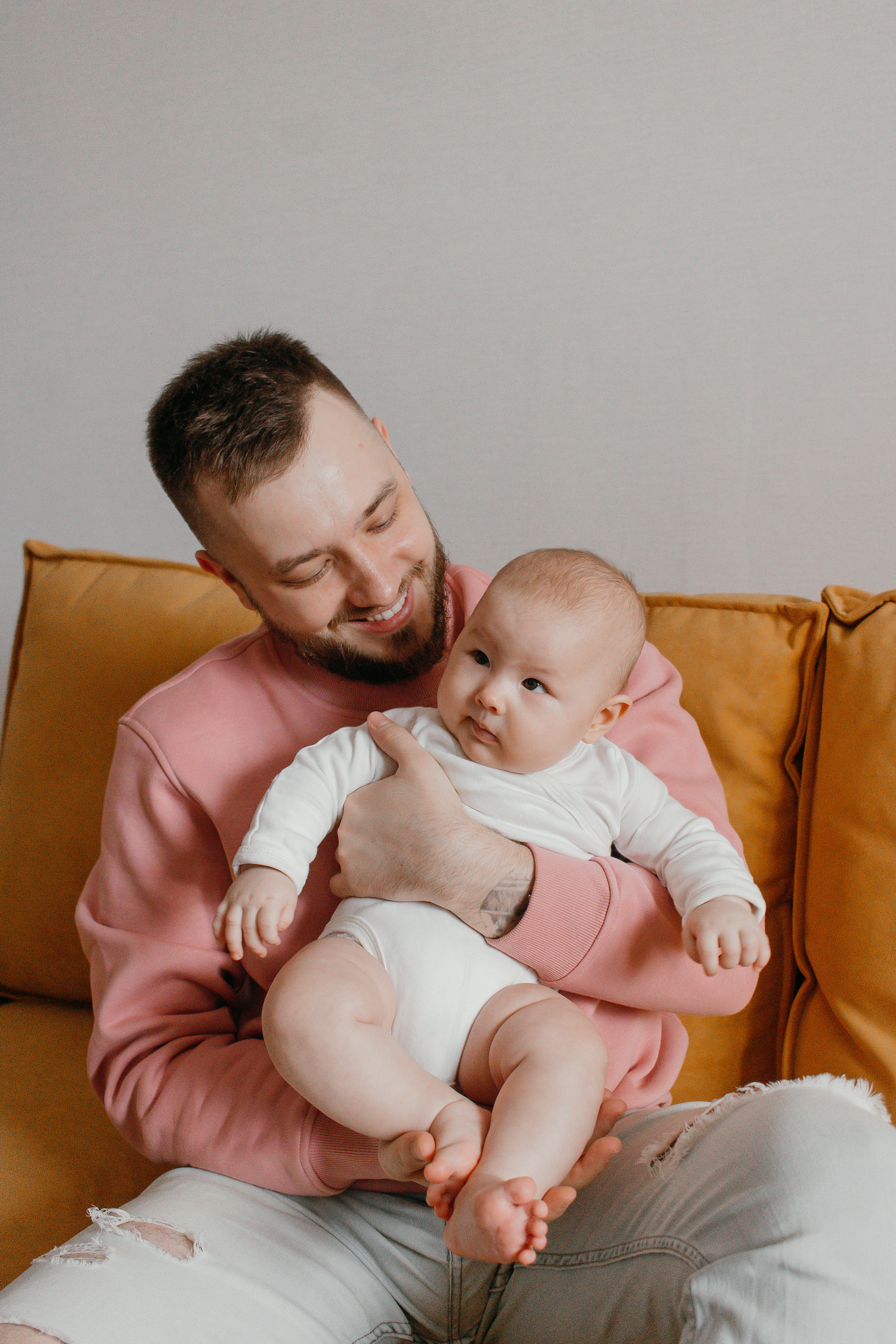 Portrait of Man with a Baby · Free Stock Photo