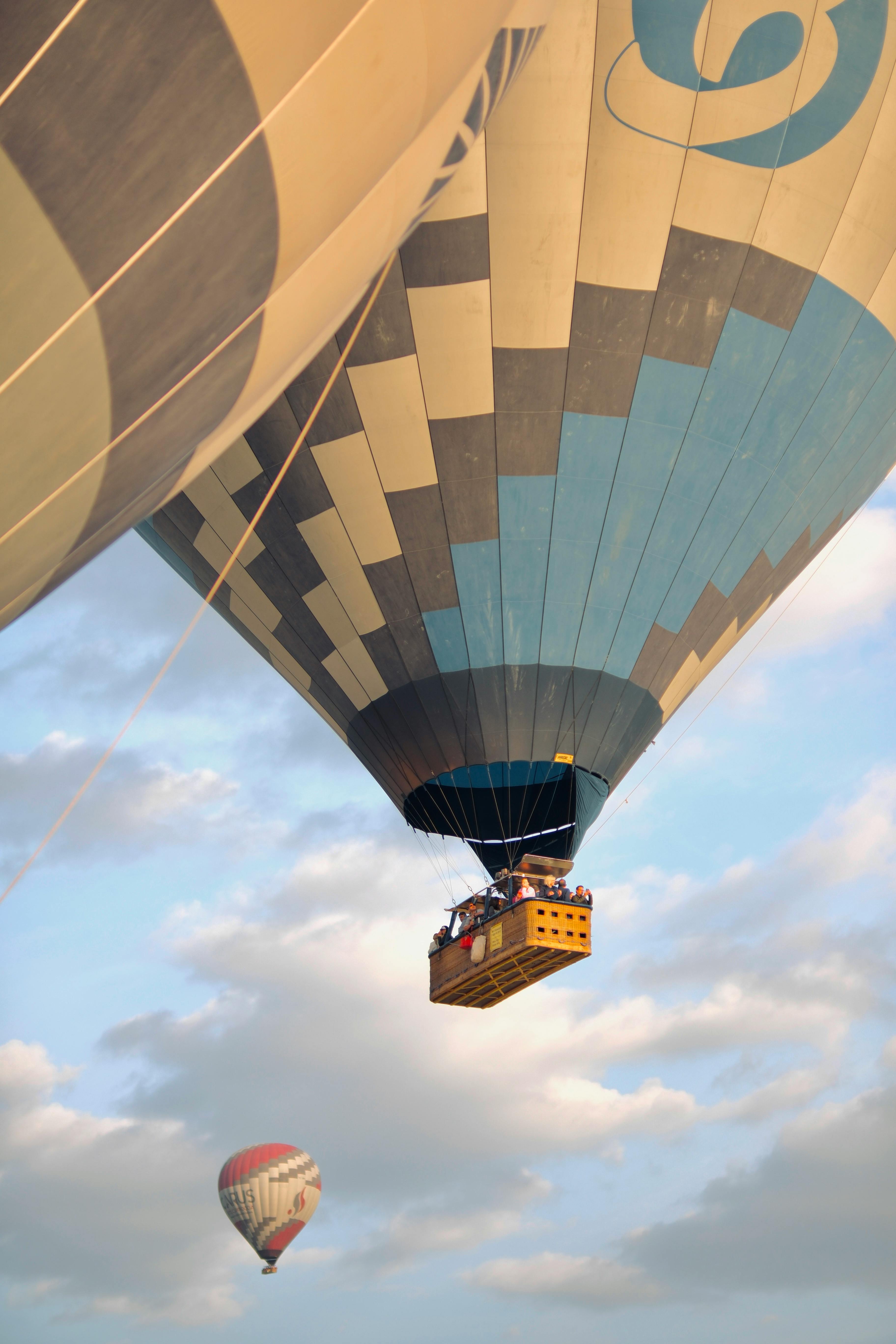 Hot Air Balloon Flying Under Blue Sky during Daytime · Free Stock Photo