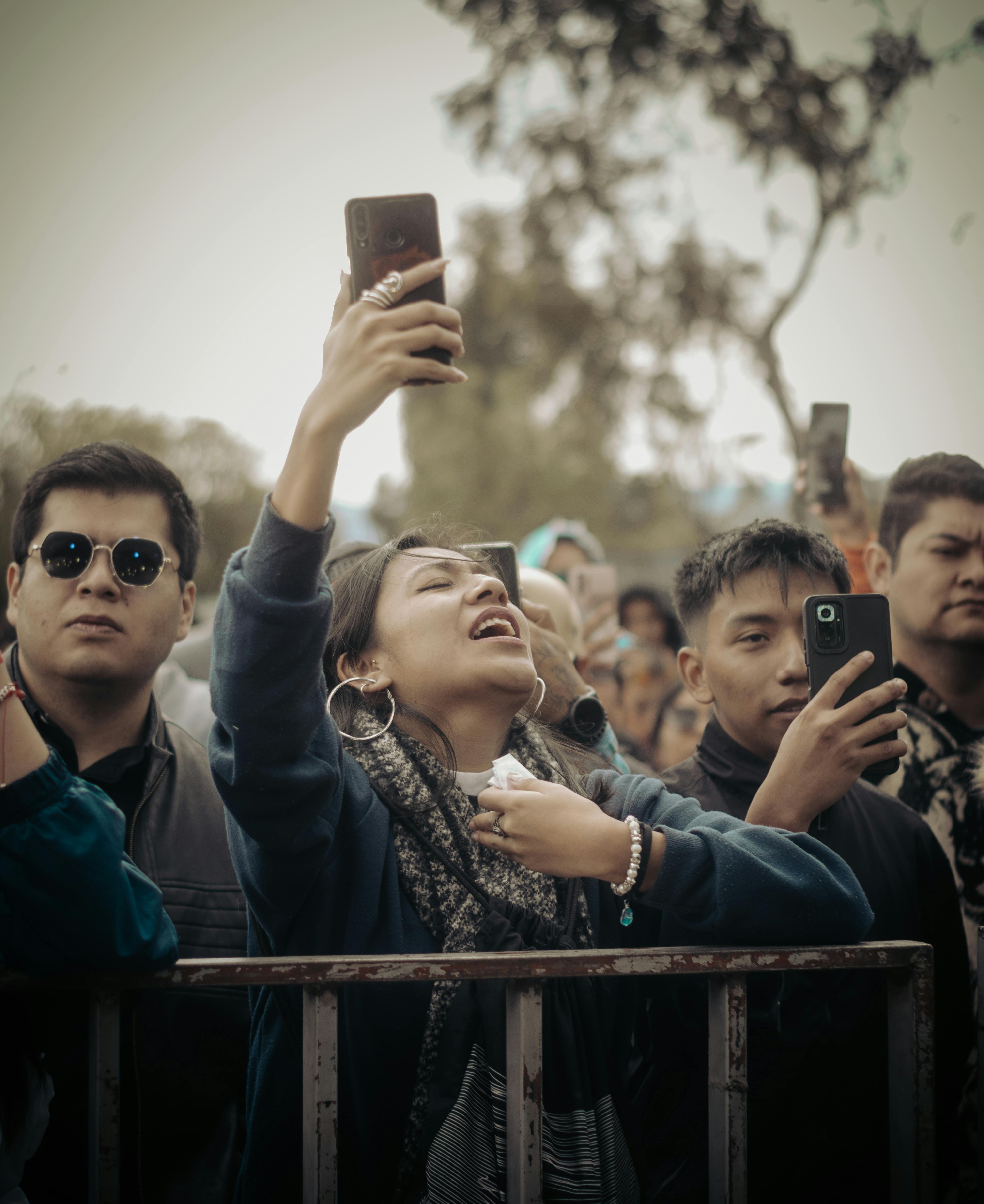 Woman in Audience Recording on Phone Singing · Free Stock Photo