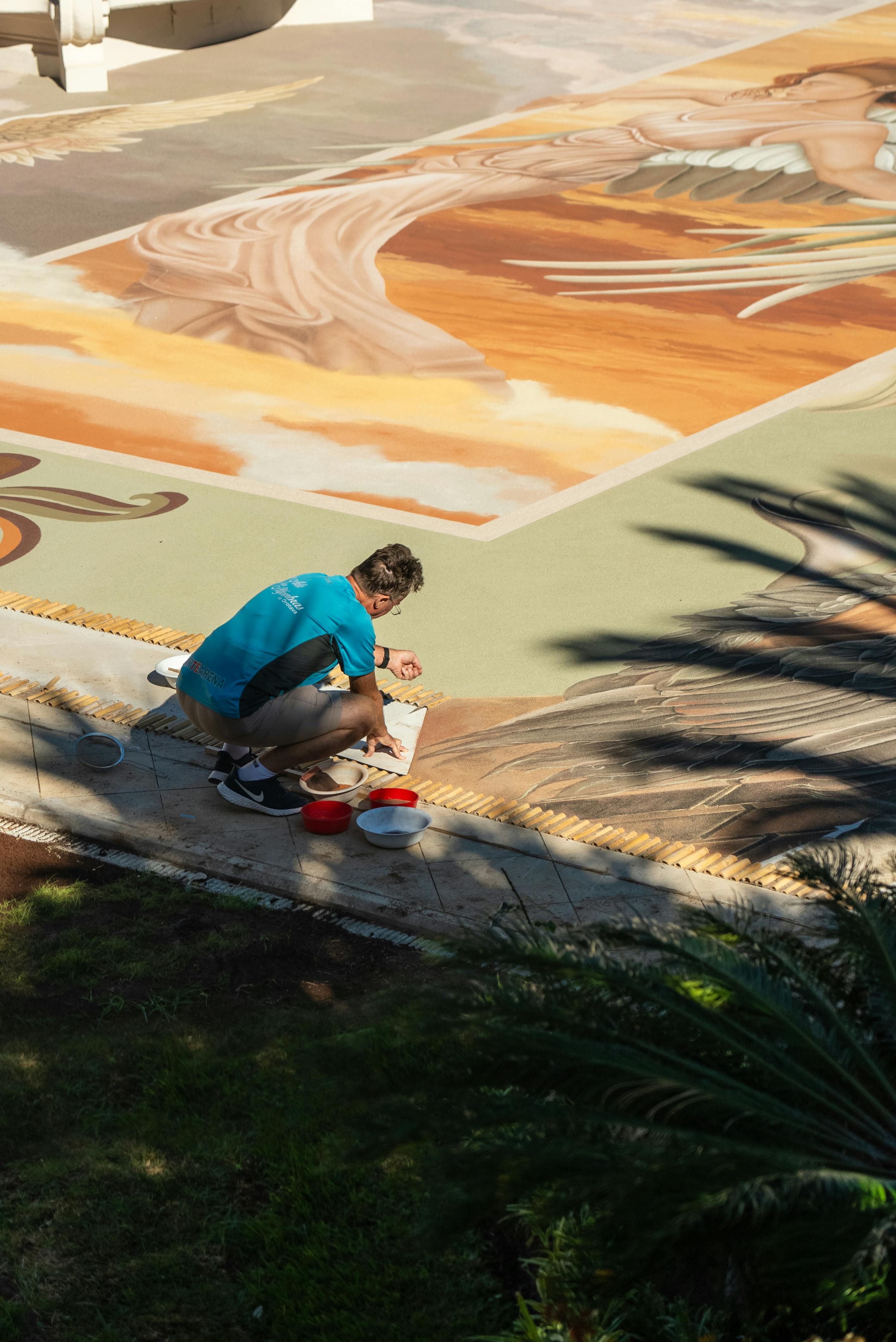 Man Painting on Pavement · Free Stock Photo