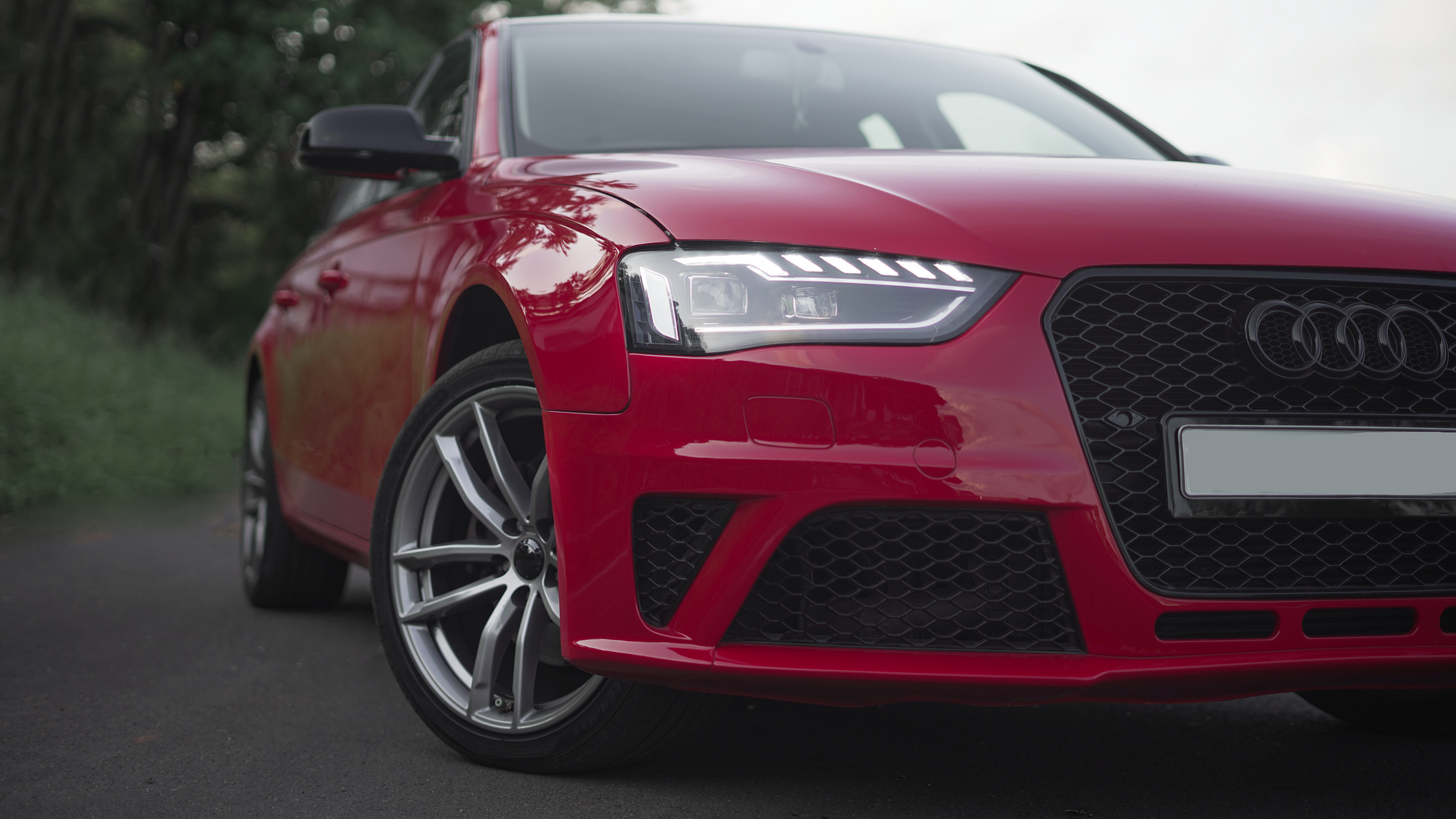 The front end of a red audi car · Free Stock Photo