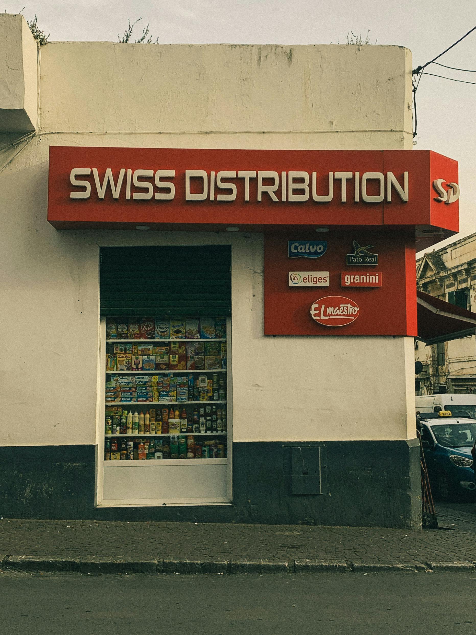 Exterior of a Swiss Distribution Store in a City · Free Stock Photo