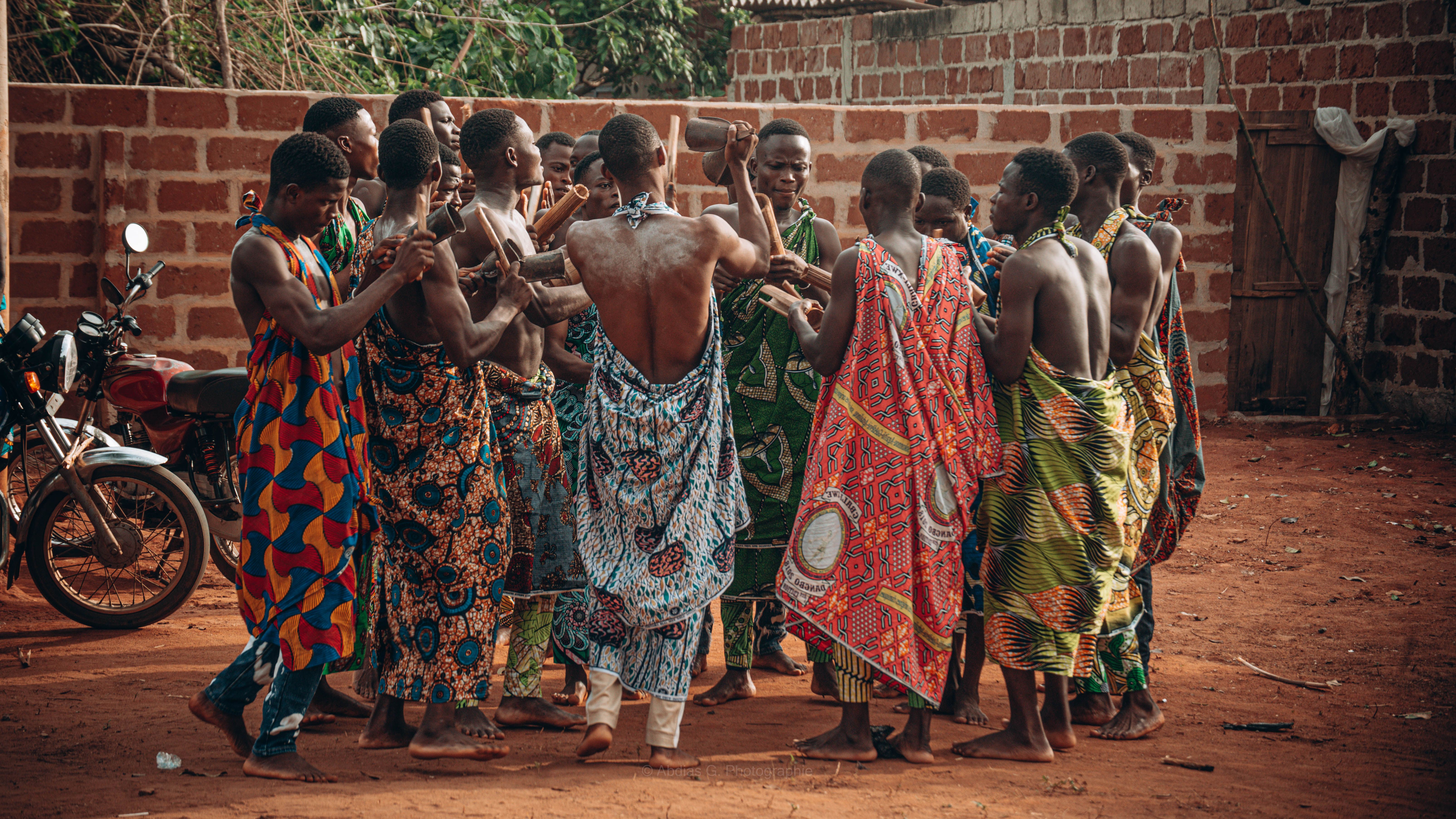 A Group of People Dancing in Traditional Patterned Clothing · Free ...