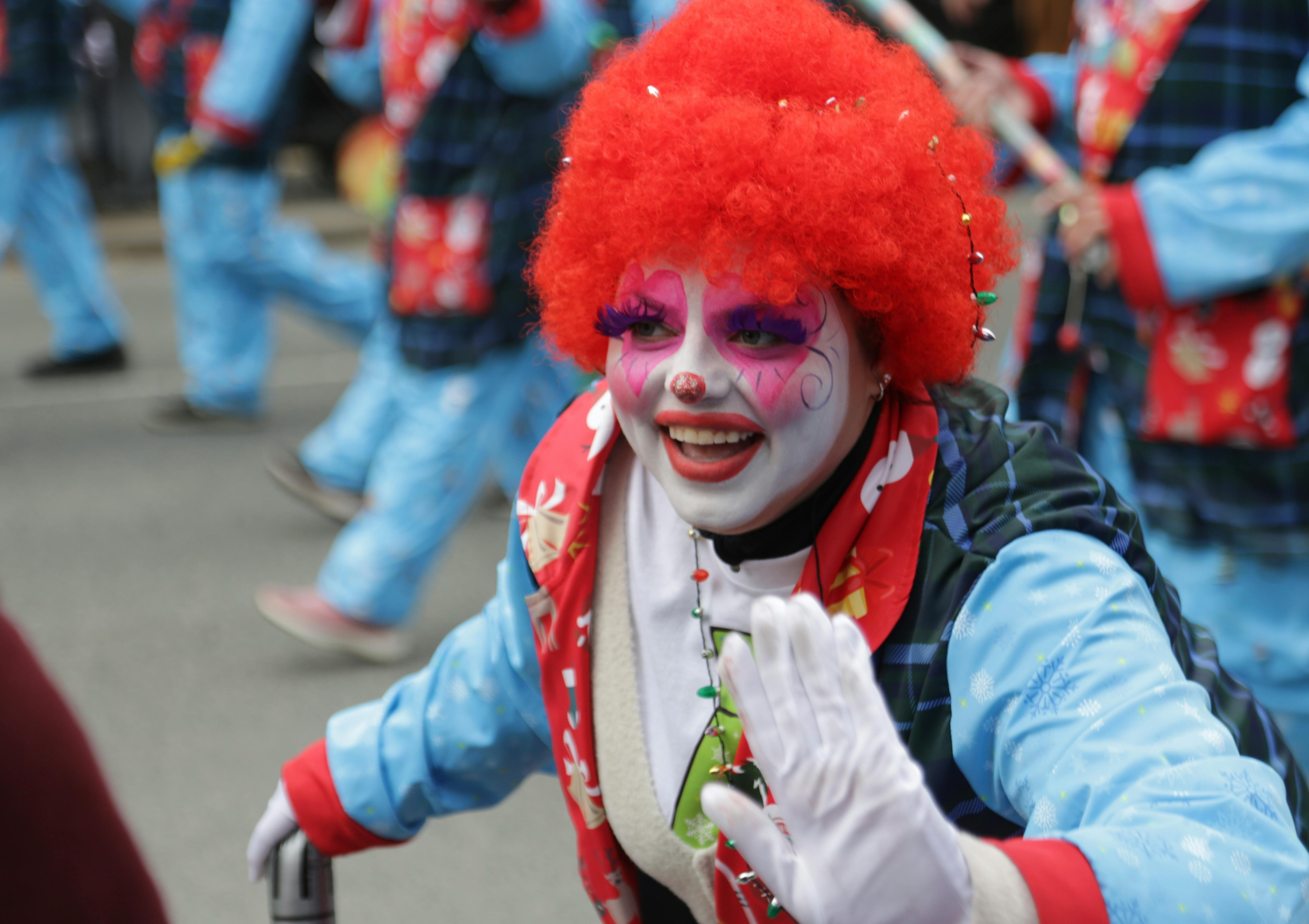 Smiling Person in Clown Costume Dancing · Free Stock Photo