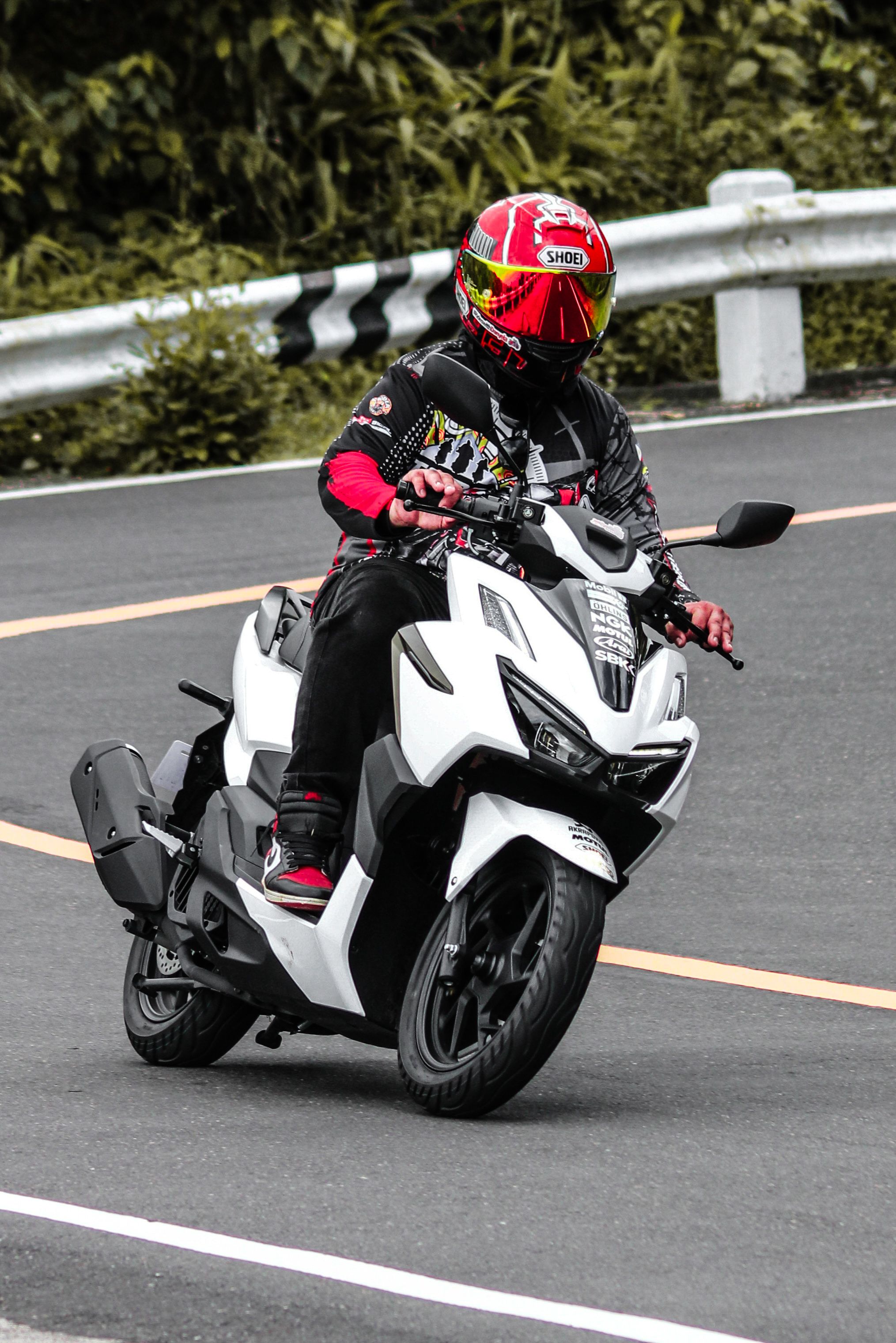 Person in Helmet Riding Honda Click · Free Stock Photo