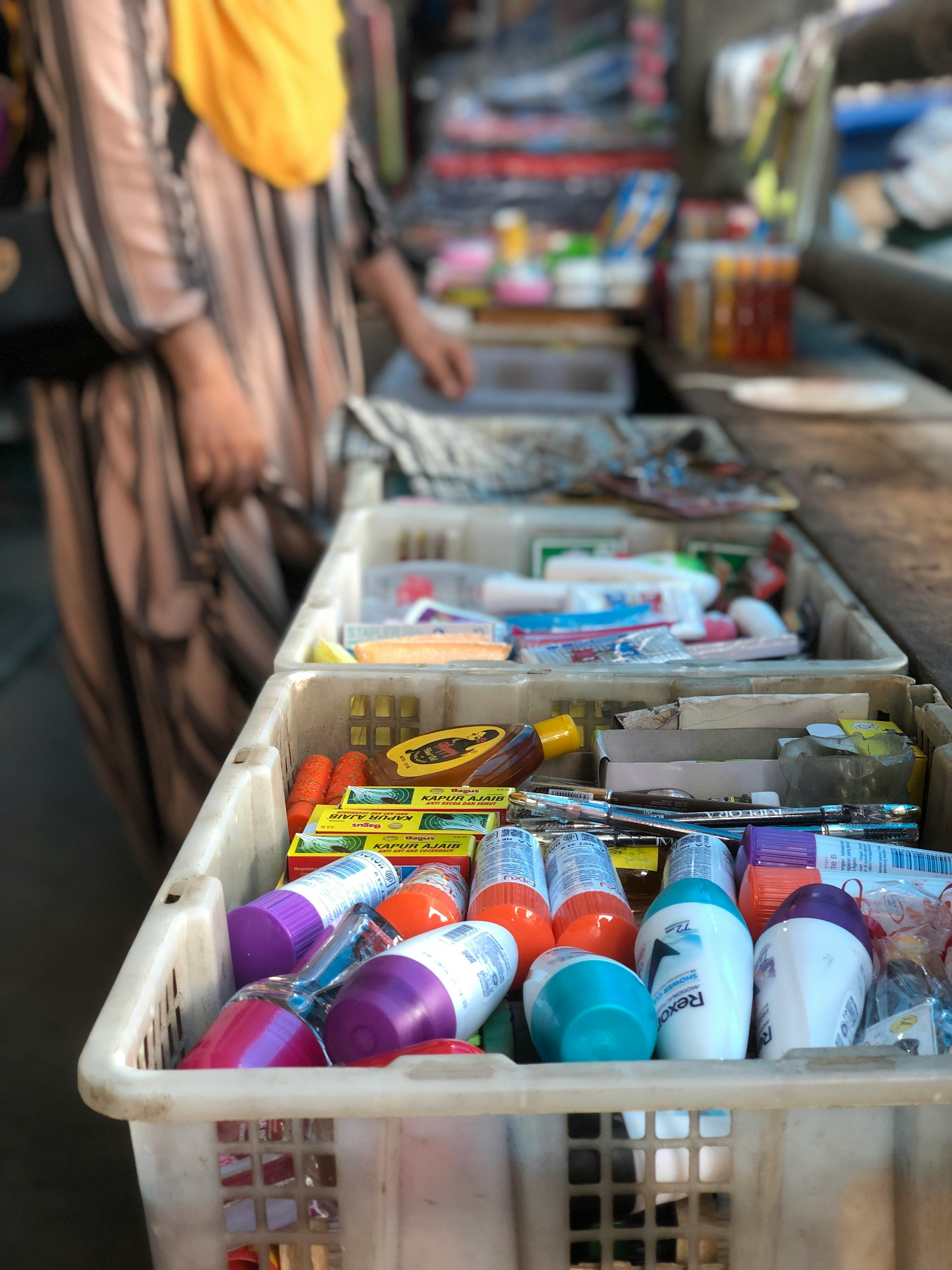 Plastic Containers with Products in Market Stand · Free Stock Photo