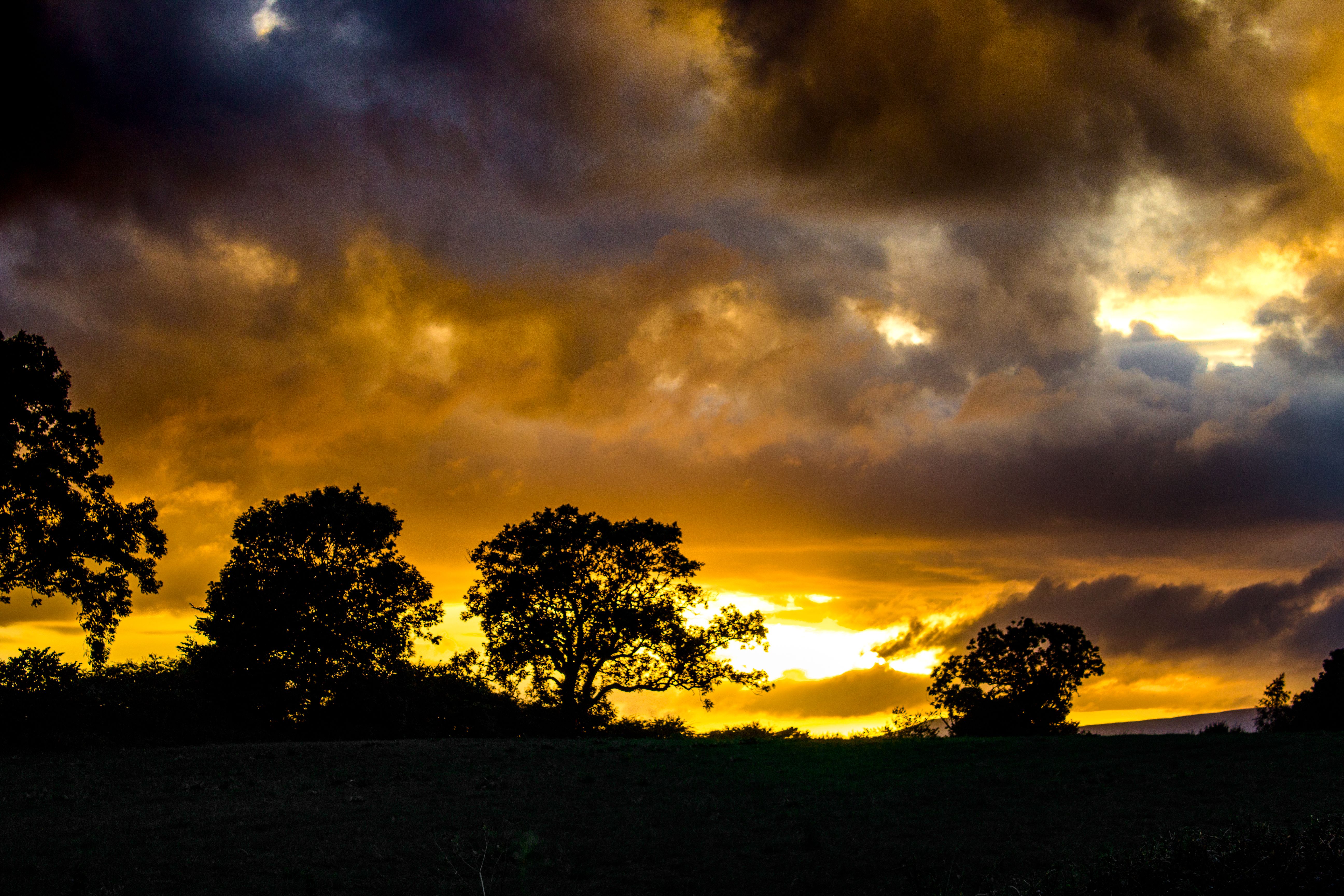 Silhouette Landscape Against Dramatic Sky during Sunset · Free Stock Photo