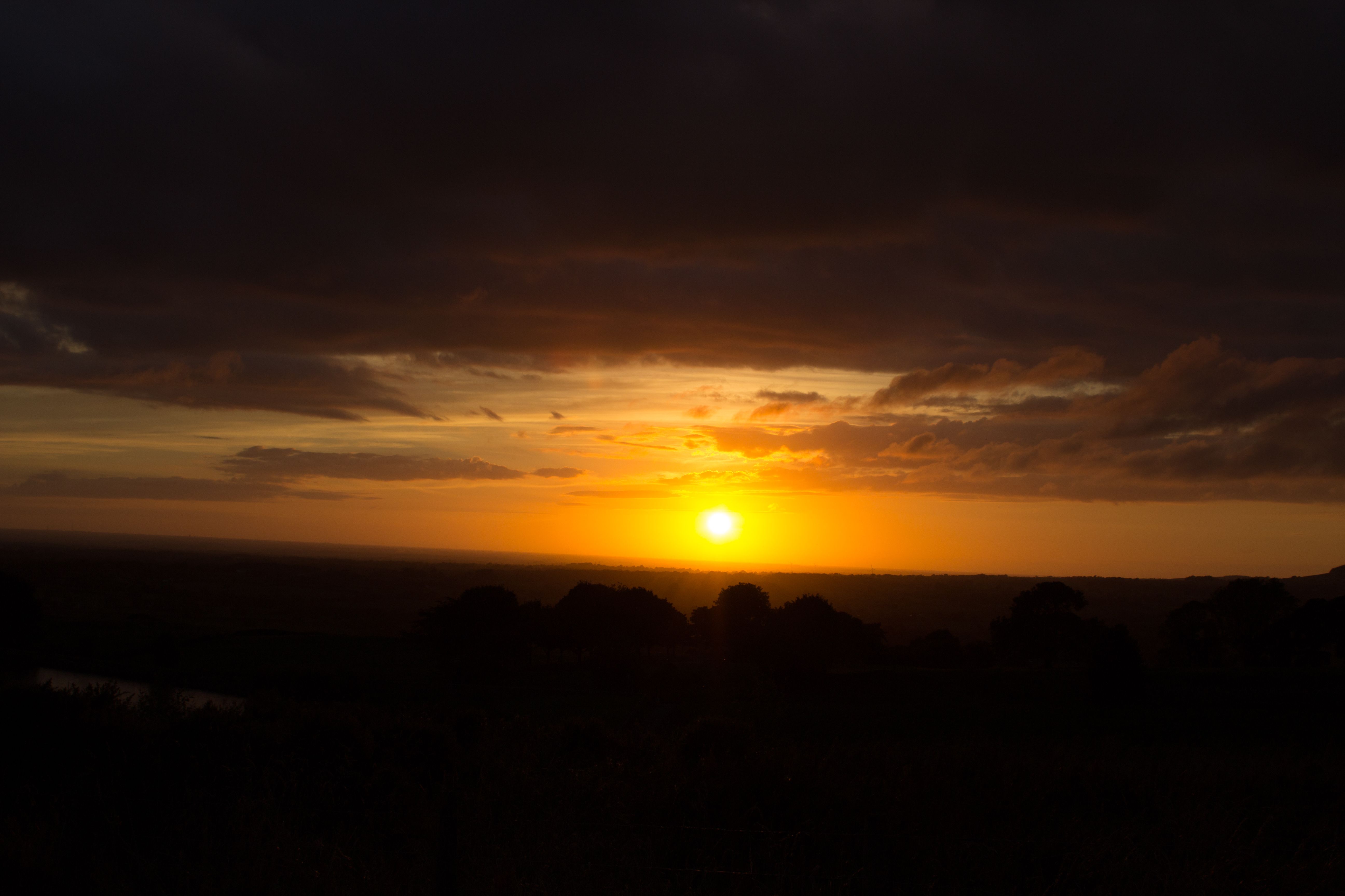 Silhouette Landscape Against Dramatic Sky during Sunset · Free Stock Photo