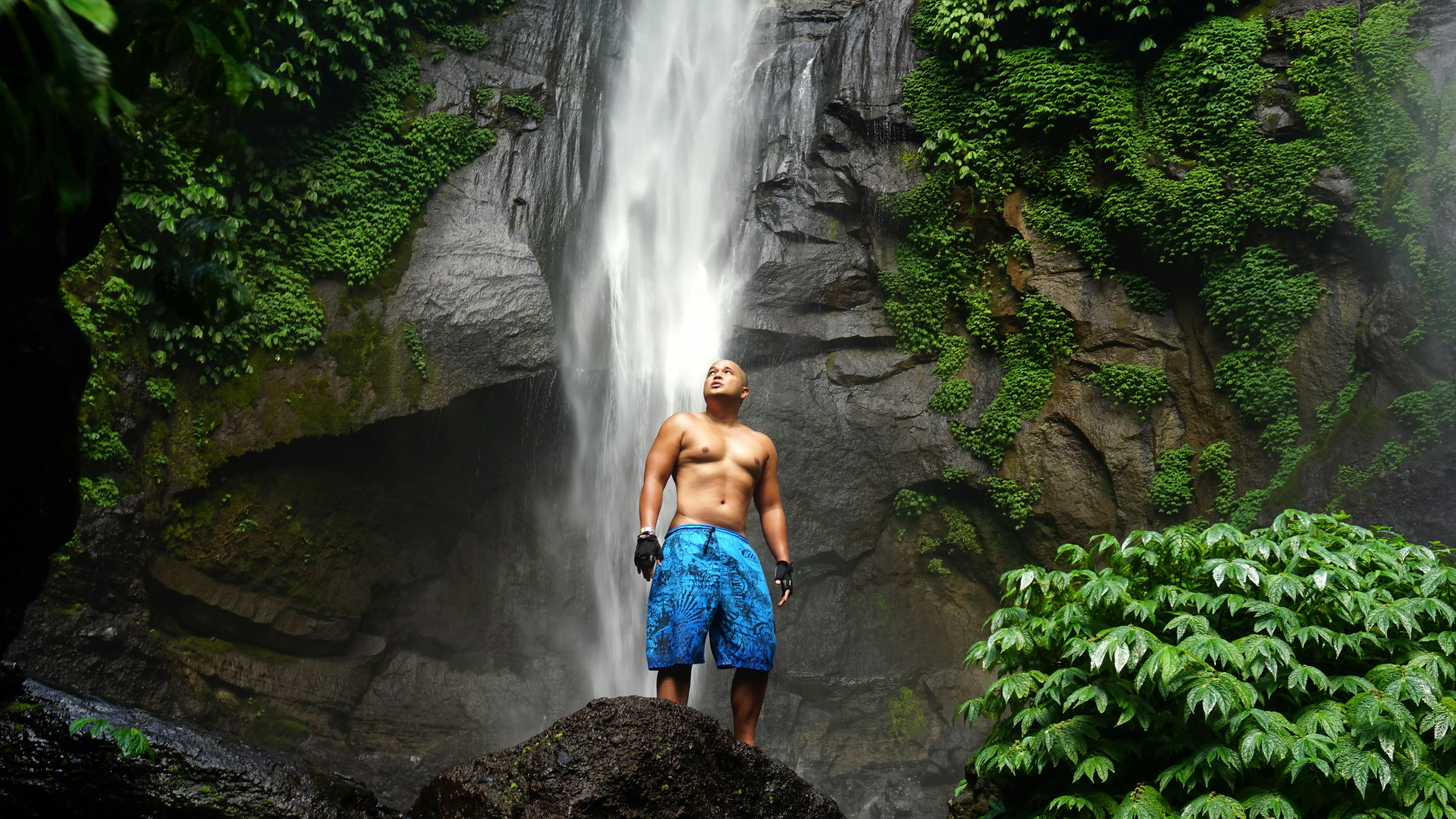 Man Standing Near Waterfalls · Free Stock Photo