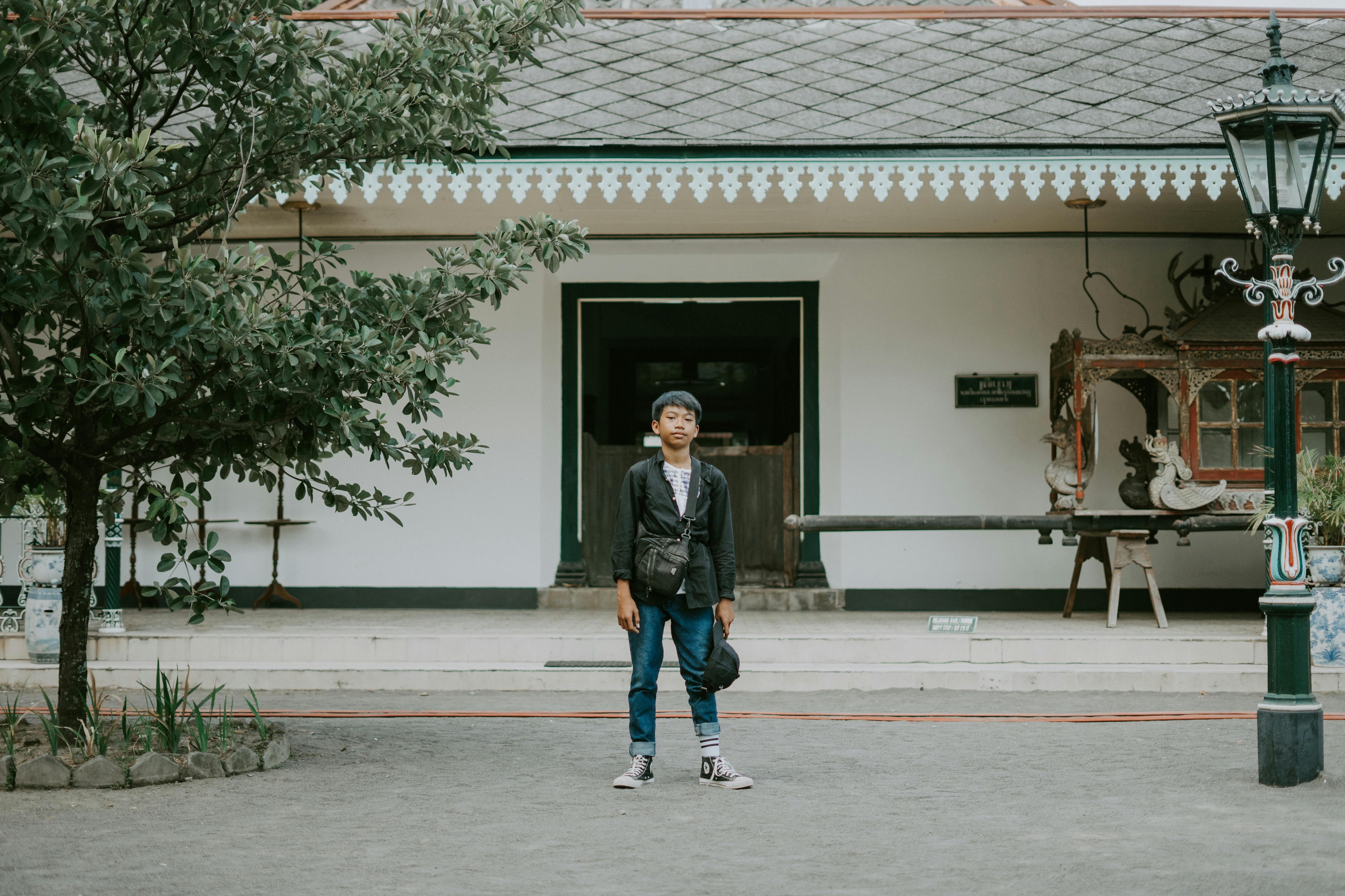 Person Standing In Front Of A Building · Free Stock Photo