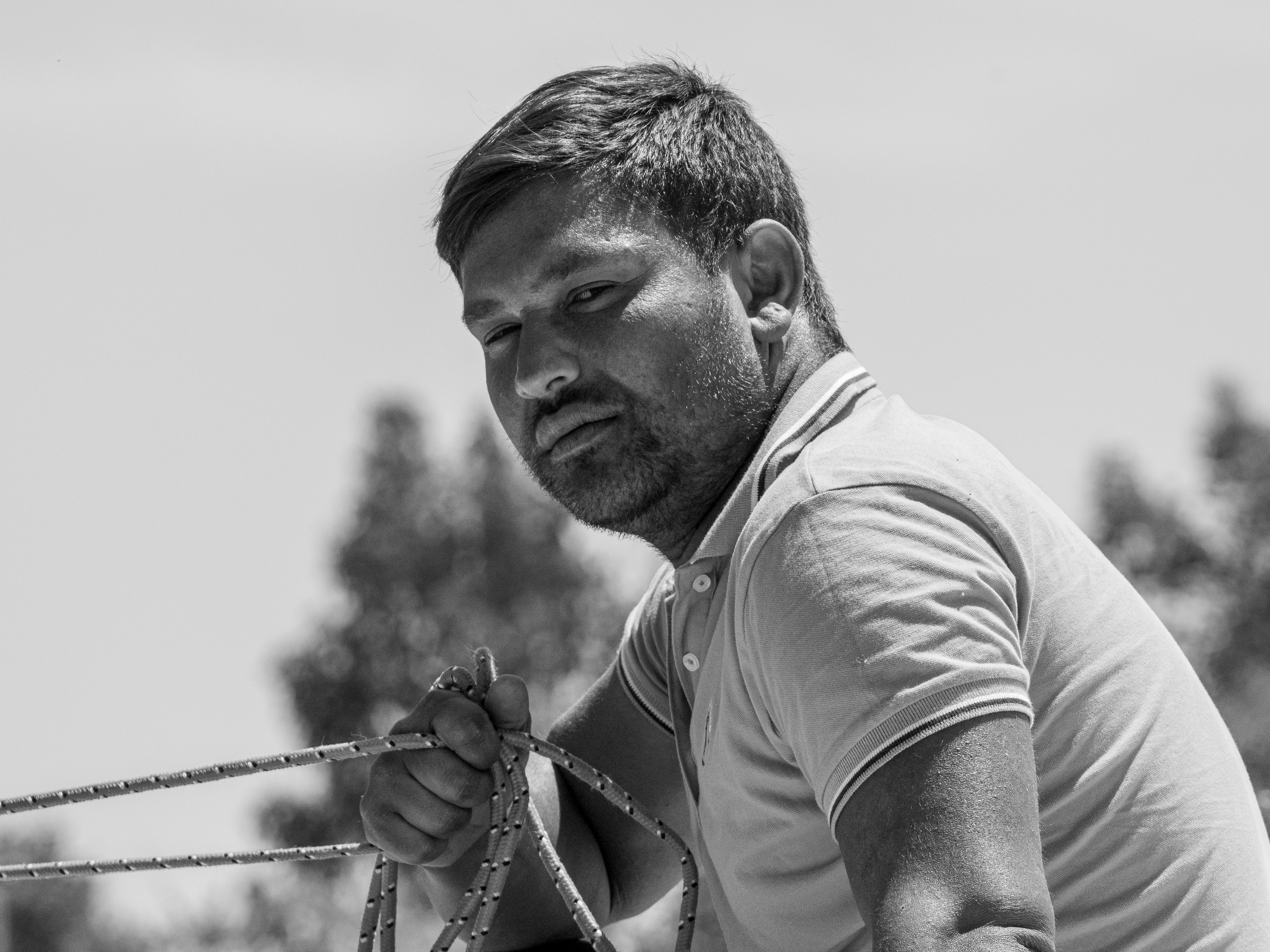 Portrait of a Man Holding a Rope · Free Stock Photo