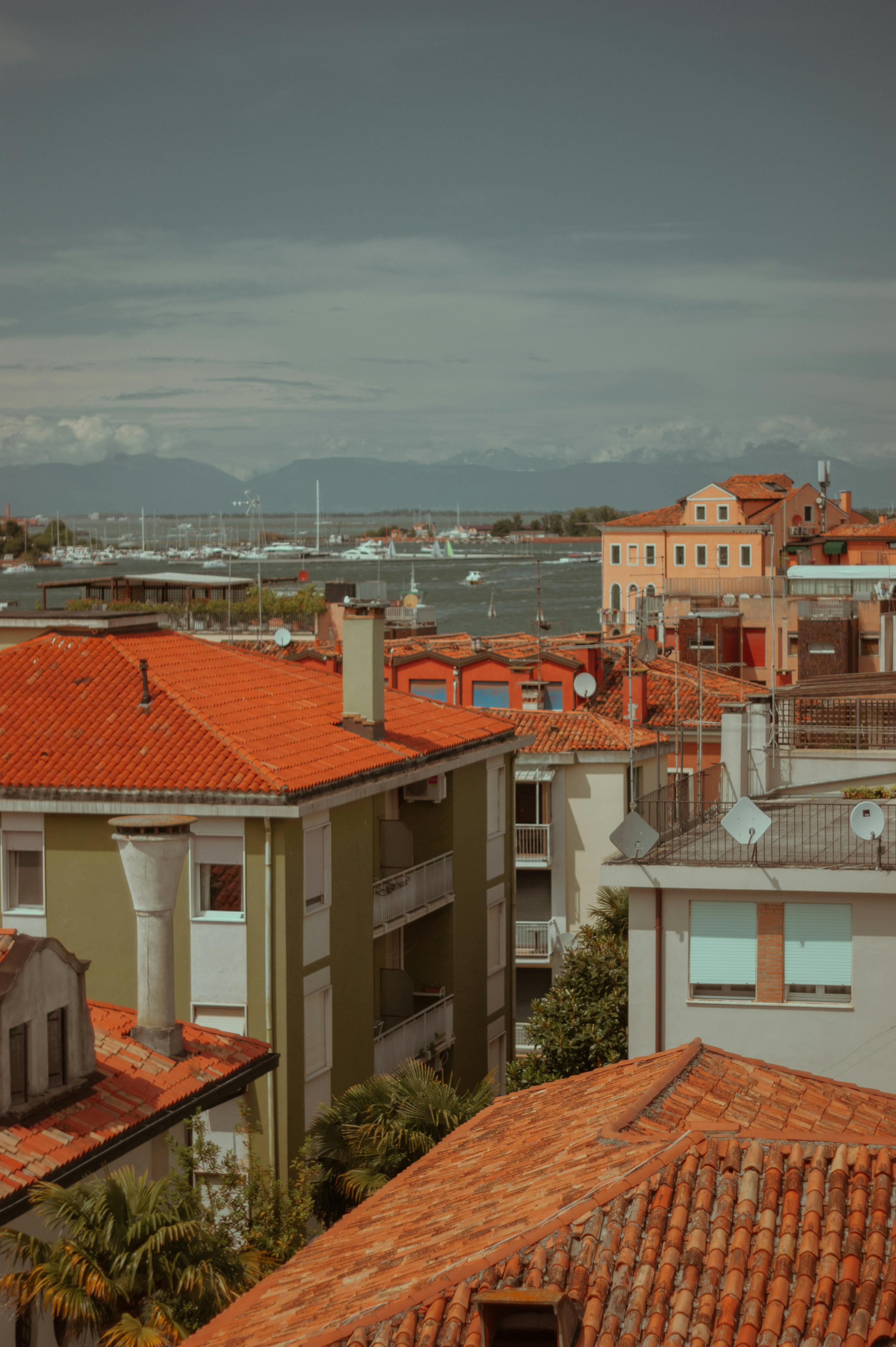 Rooftops of Houses in Town on Sea Coast · Free Stock Photo