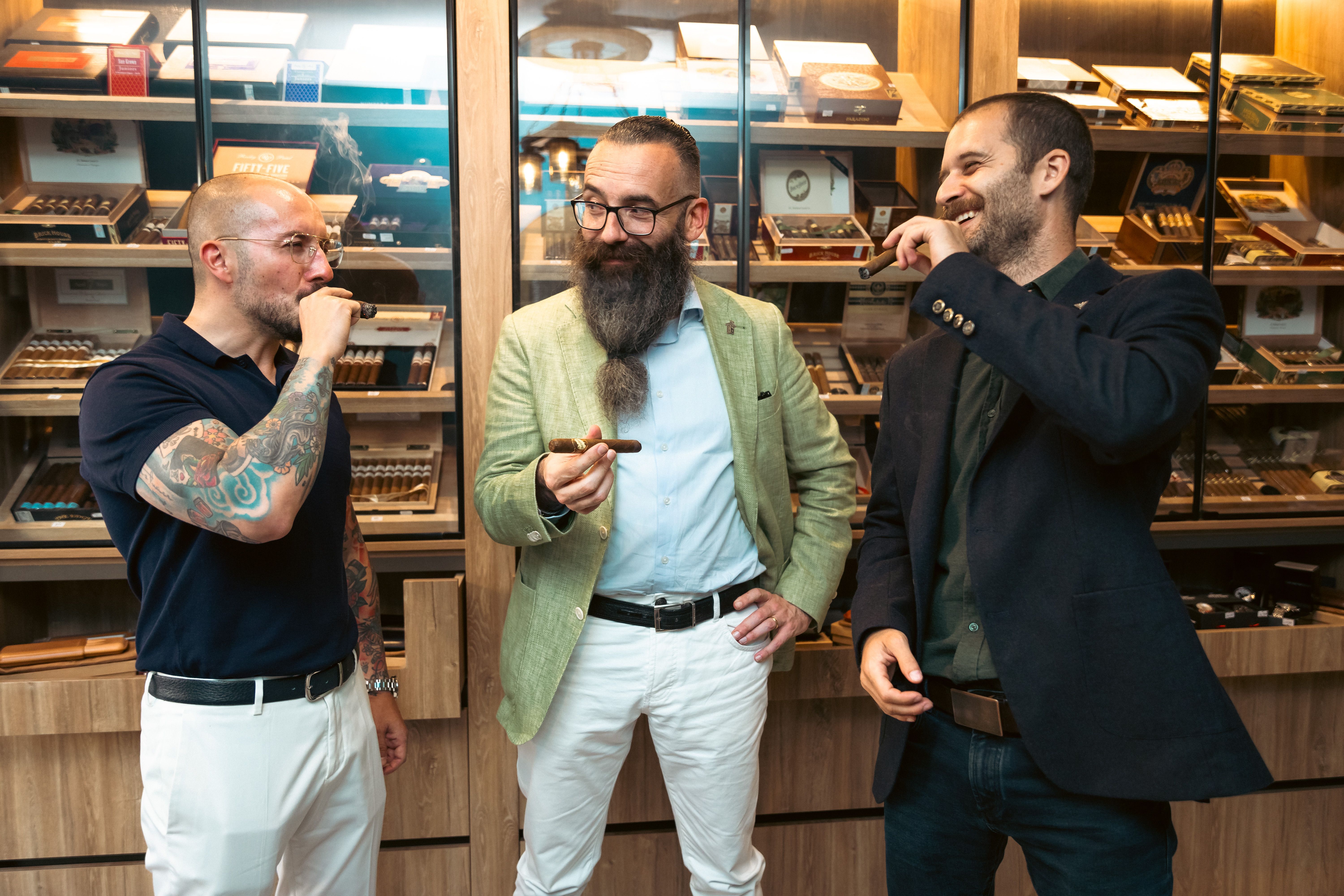 A Group of Elegant Men Smoking Cigars · Free Stock Photo
