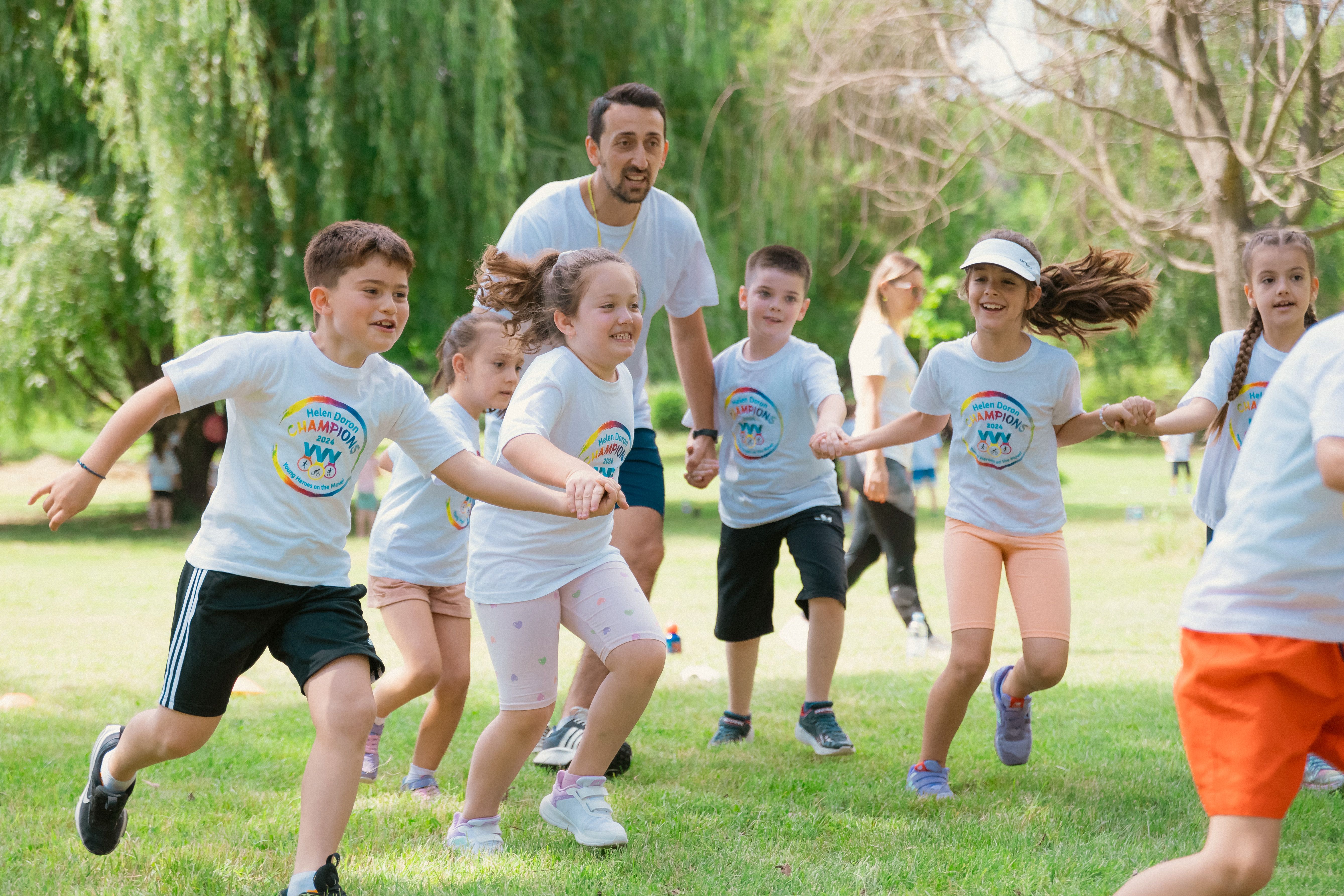 Schoolchildren Playing and Exercising in a Summer Park · Free Stock Photo