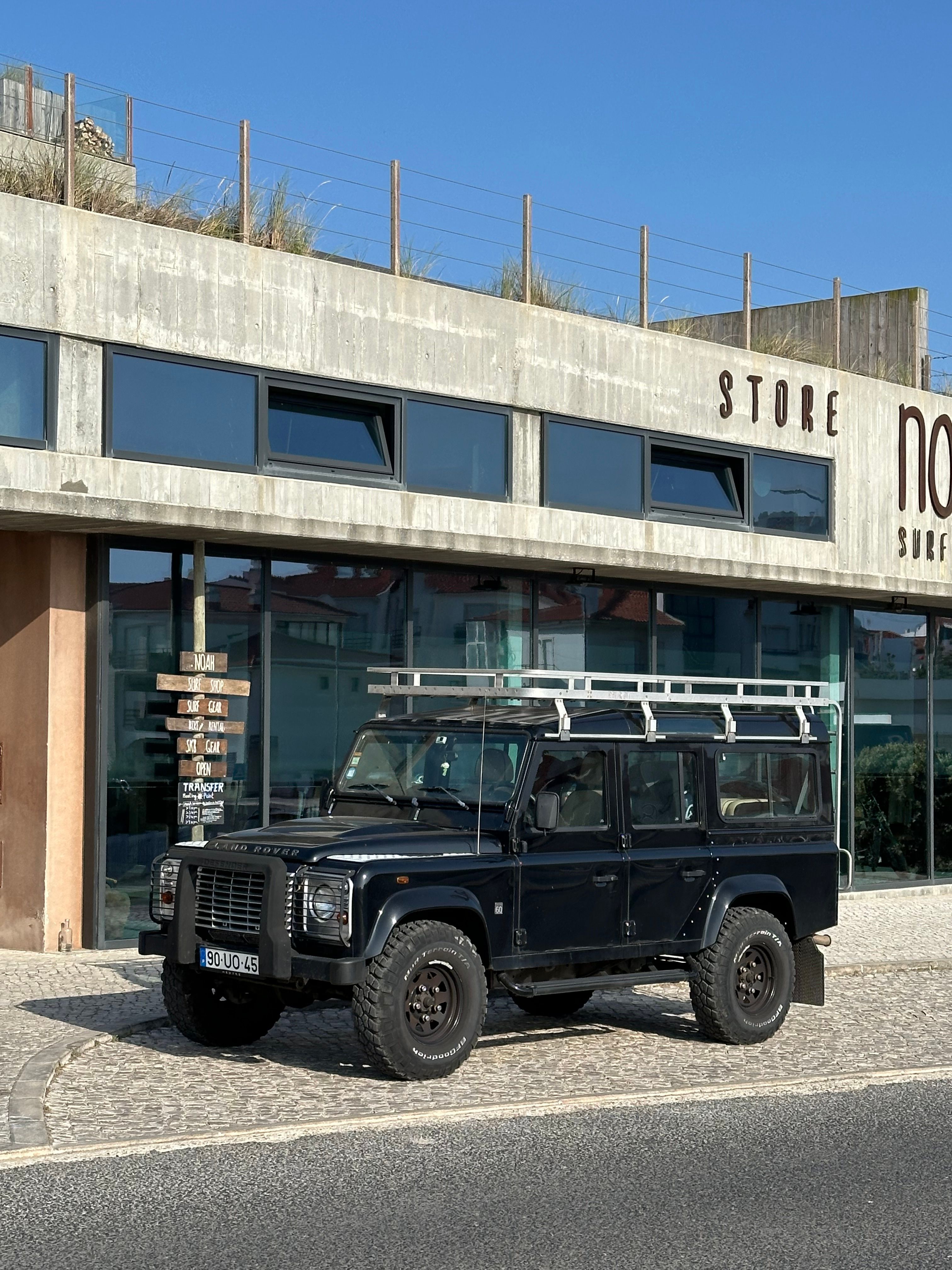 Black Land Rover Parked in Front of a Store · Free Stock Photo