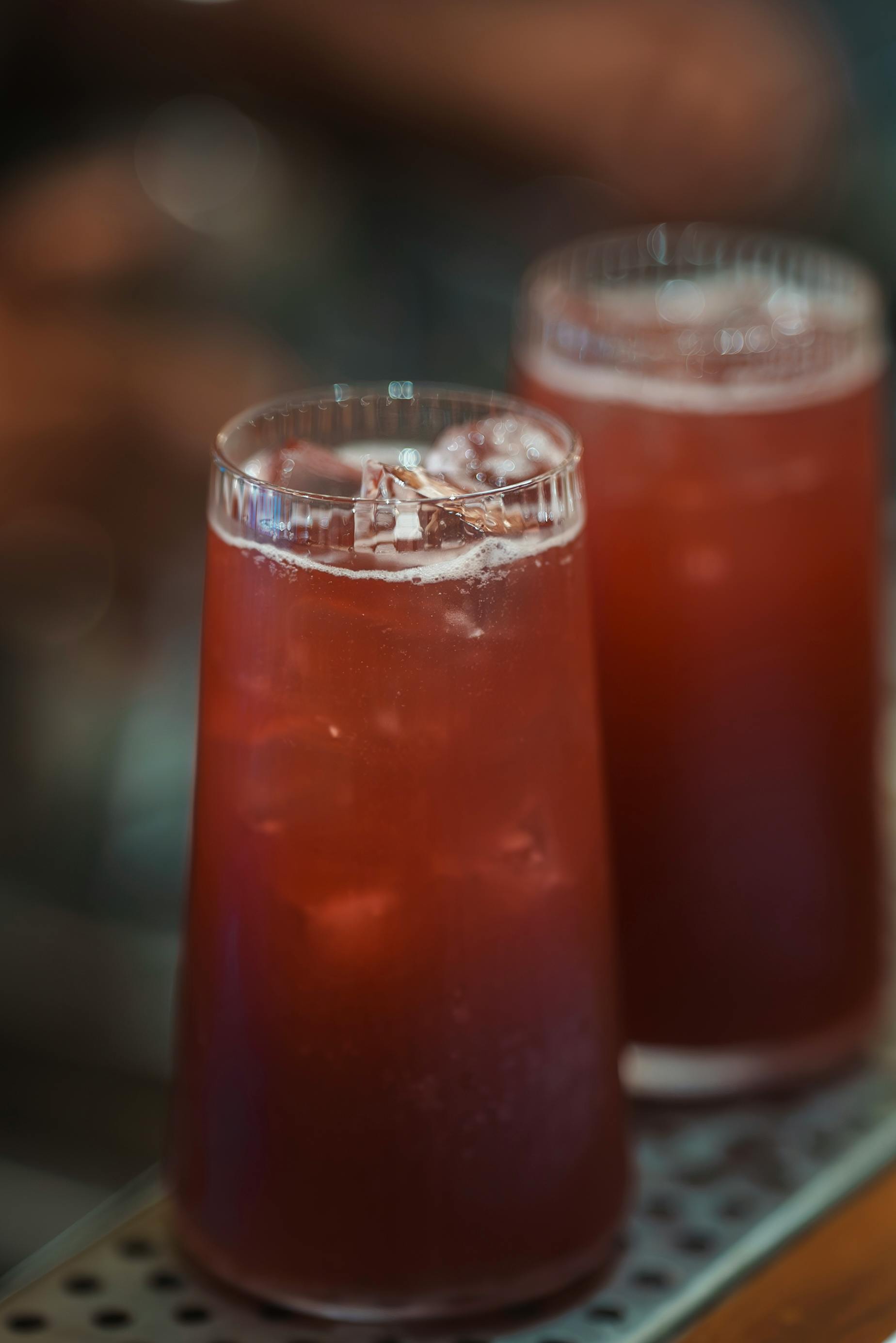 Glass of refreshing cold cocktail on table · Free Stock Photo