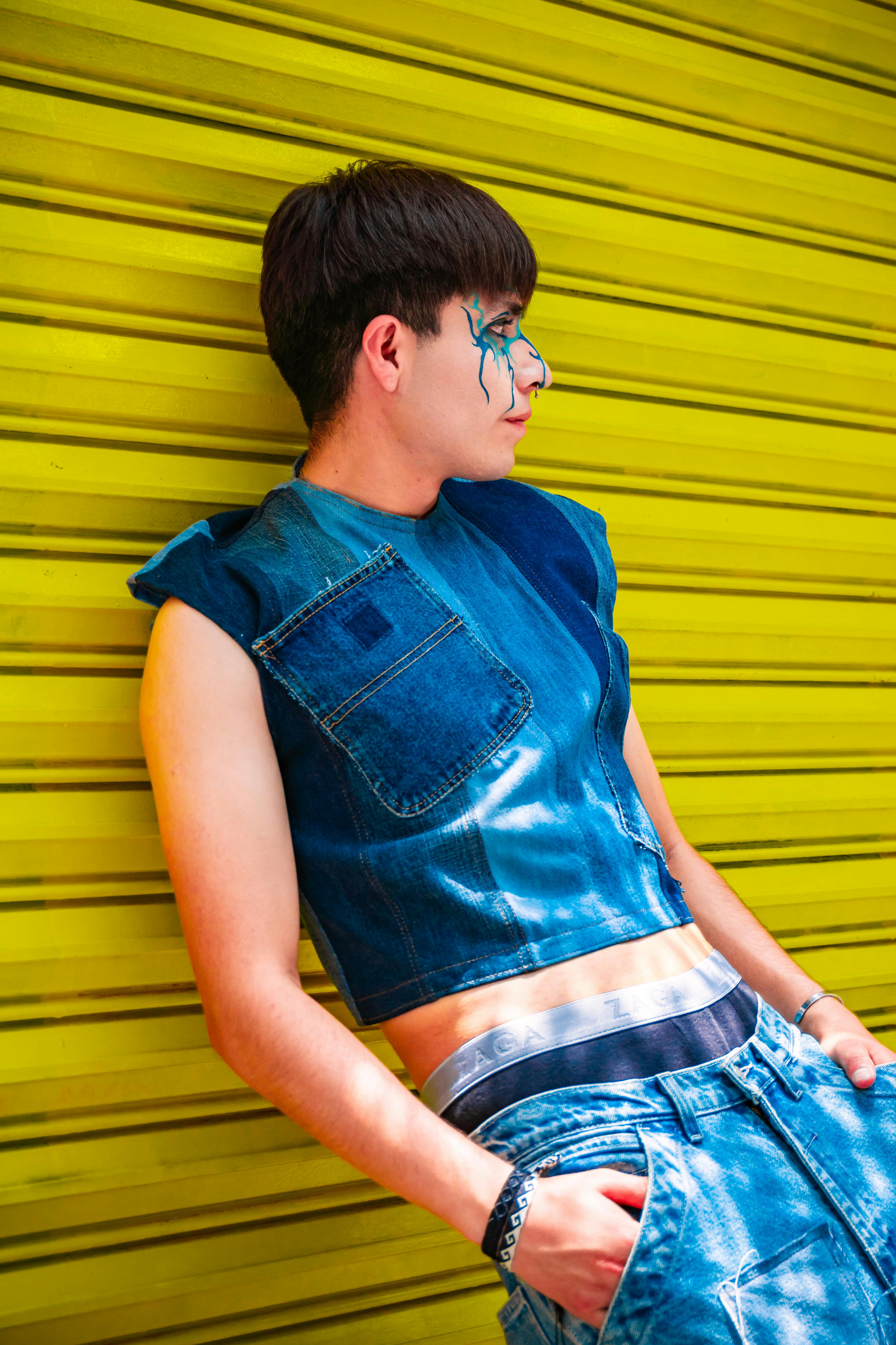 Person Wearing Custom Denim Outfit and Artistic Makeup Posing · Free ...