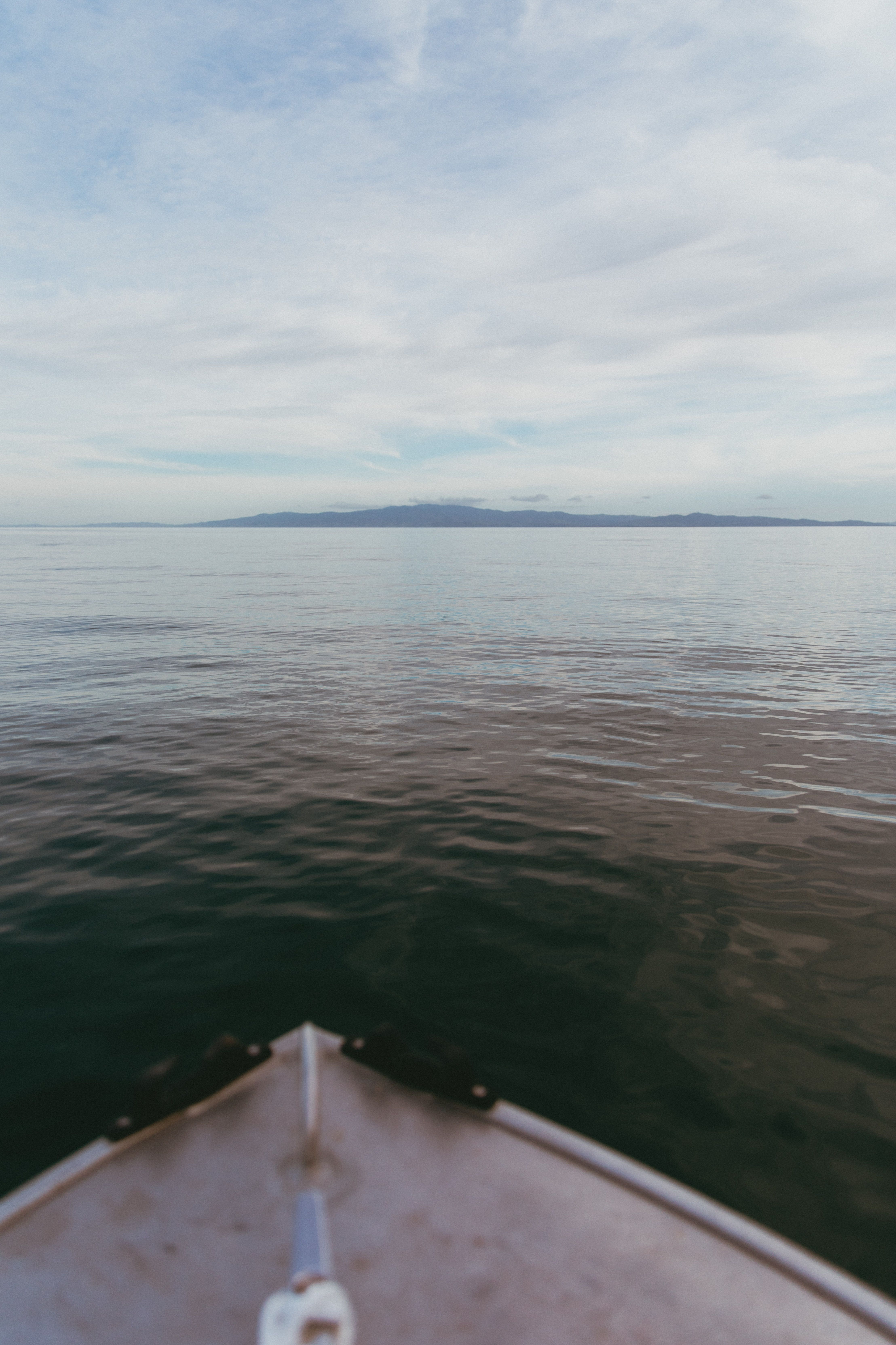 A view from the bow of a boat looking out at the water · Free Stock Photo