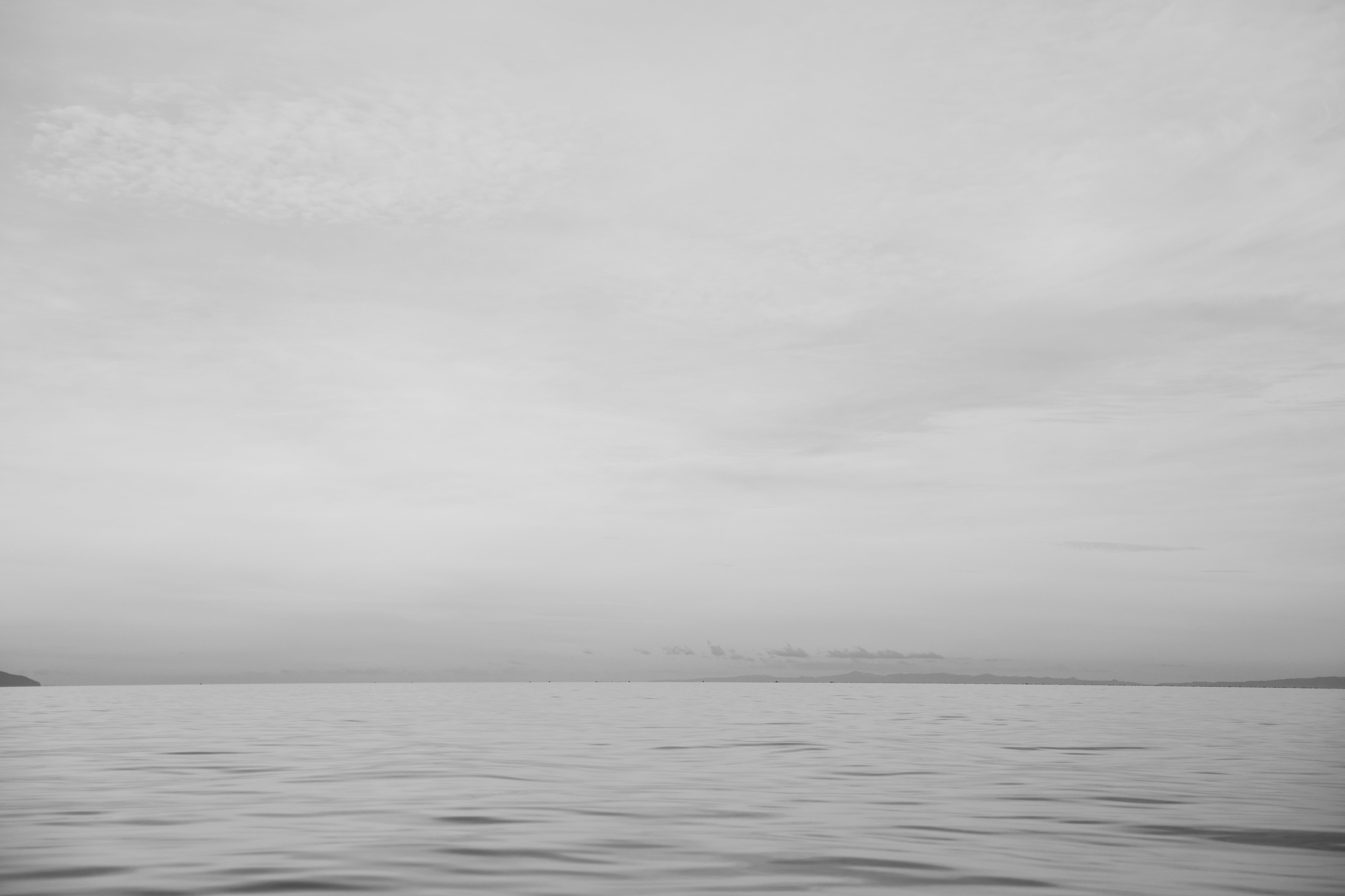 Cloud over Calm Sea in Black and White · Free Stock Photo