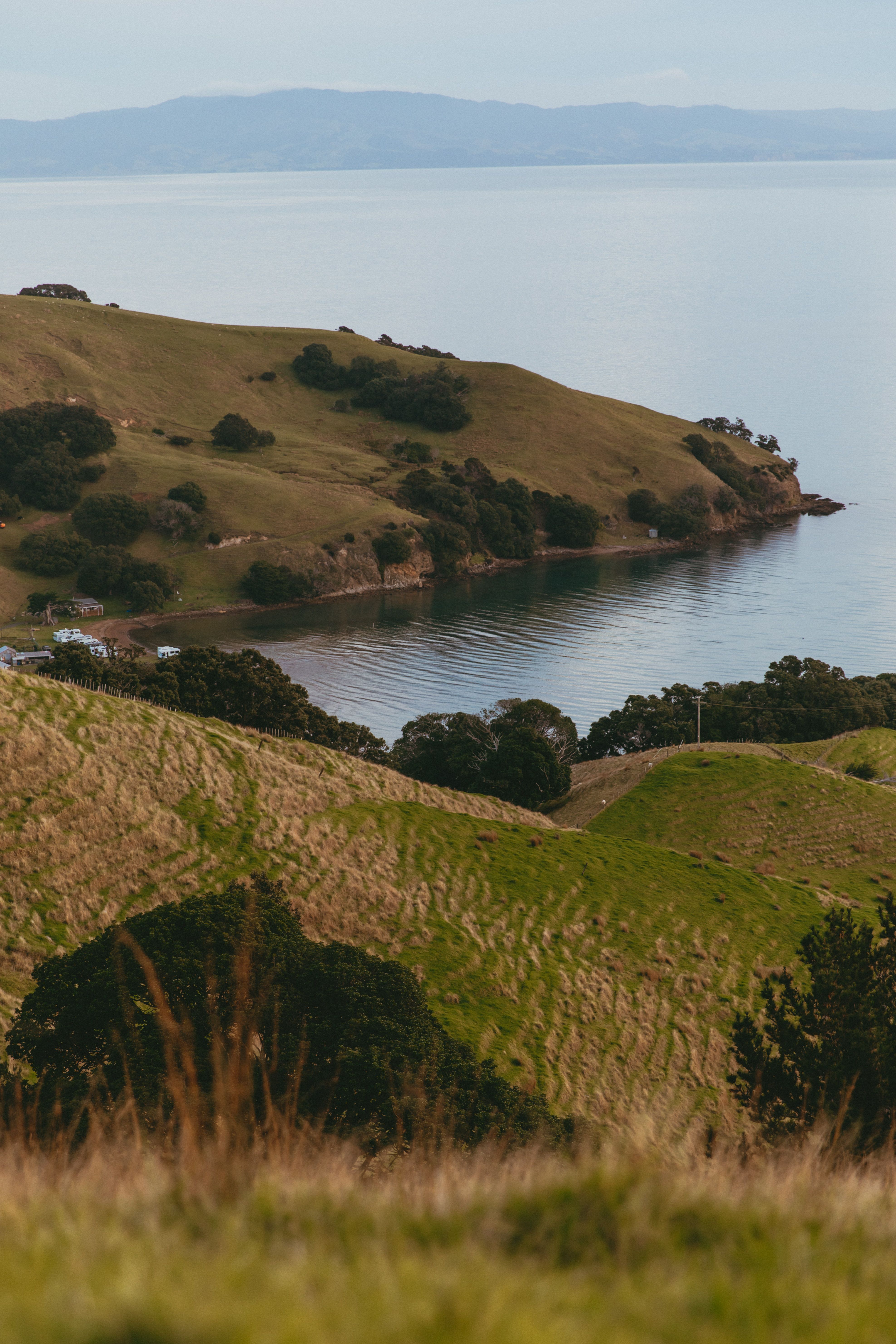 A view of the ocean and hills from a hill · Free Stock Photo