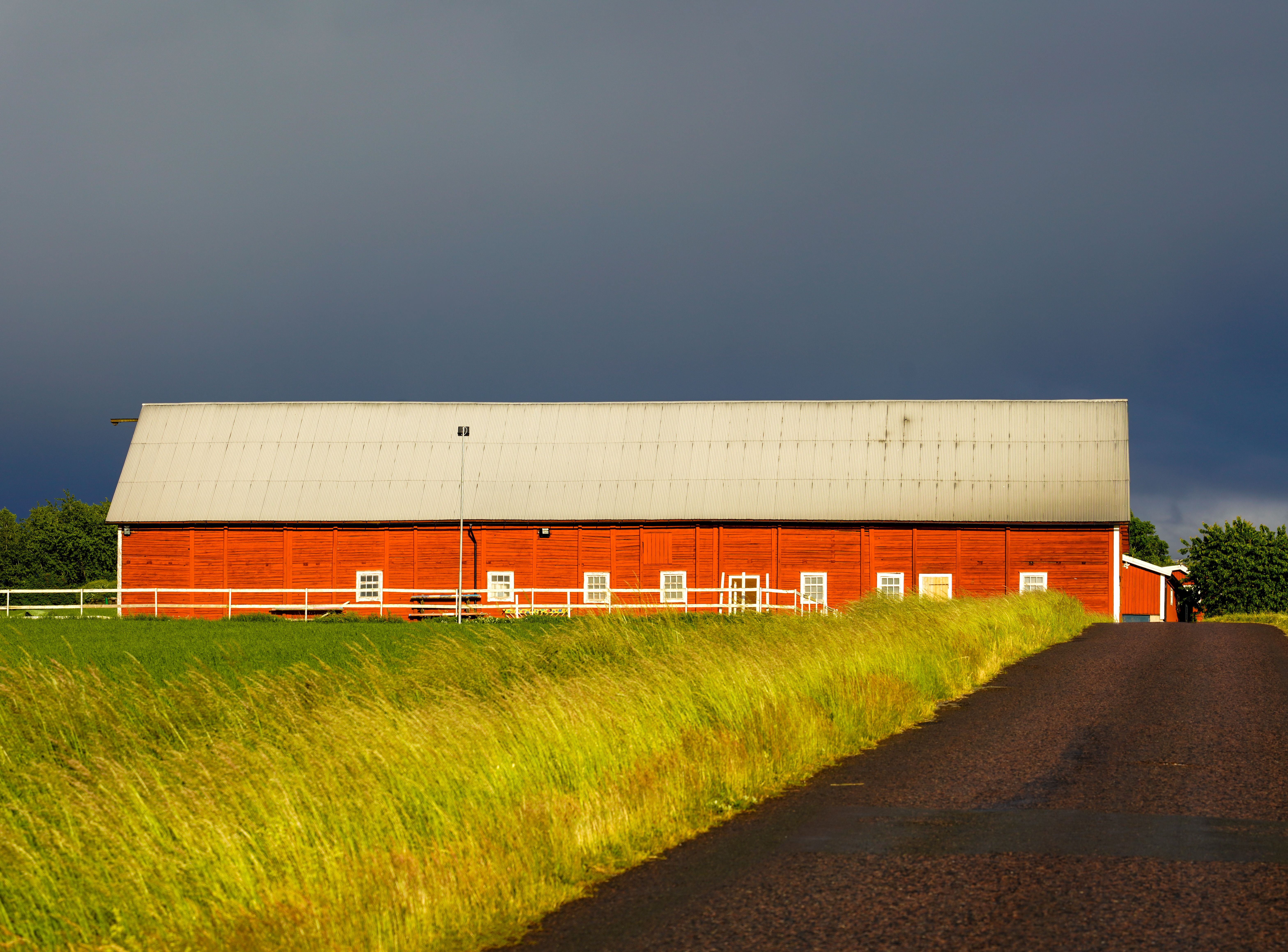 Storm Cloud over Barn in Countryside · Free Stock Photo