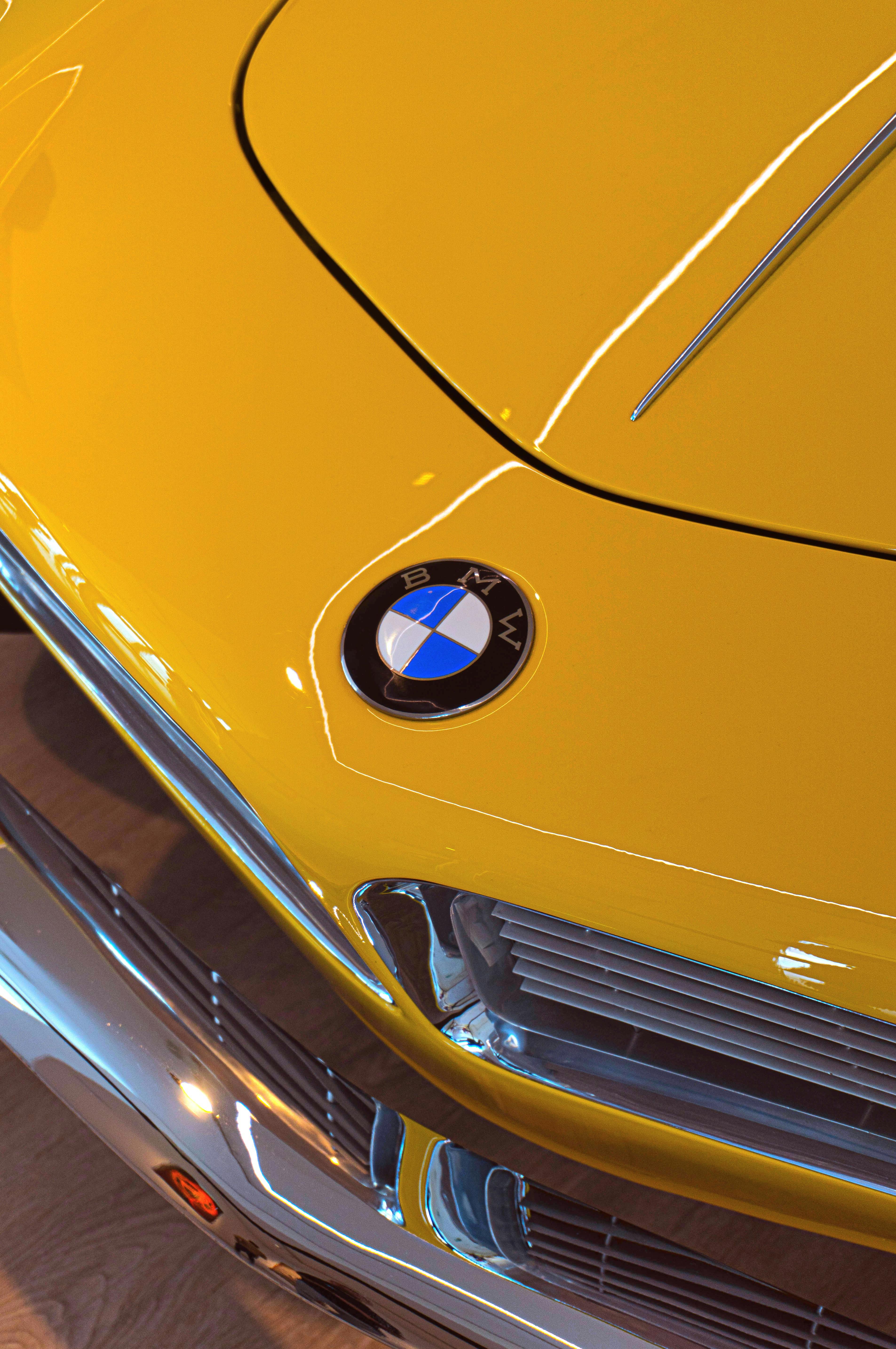 BMW Sign on Yellow Car · Free Stock Photo