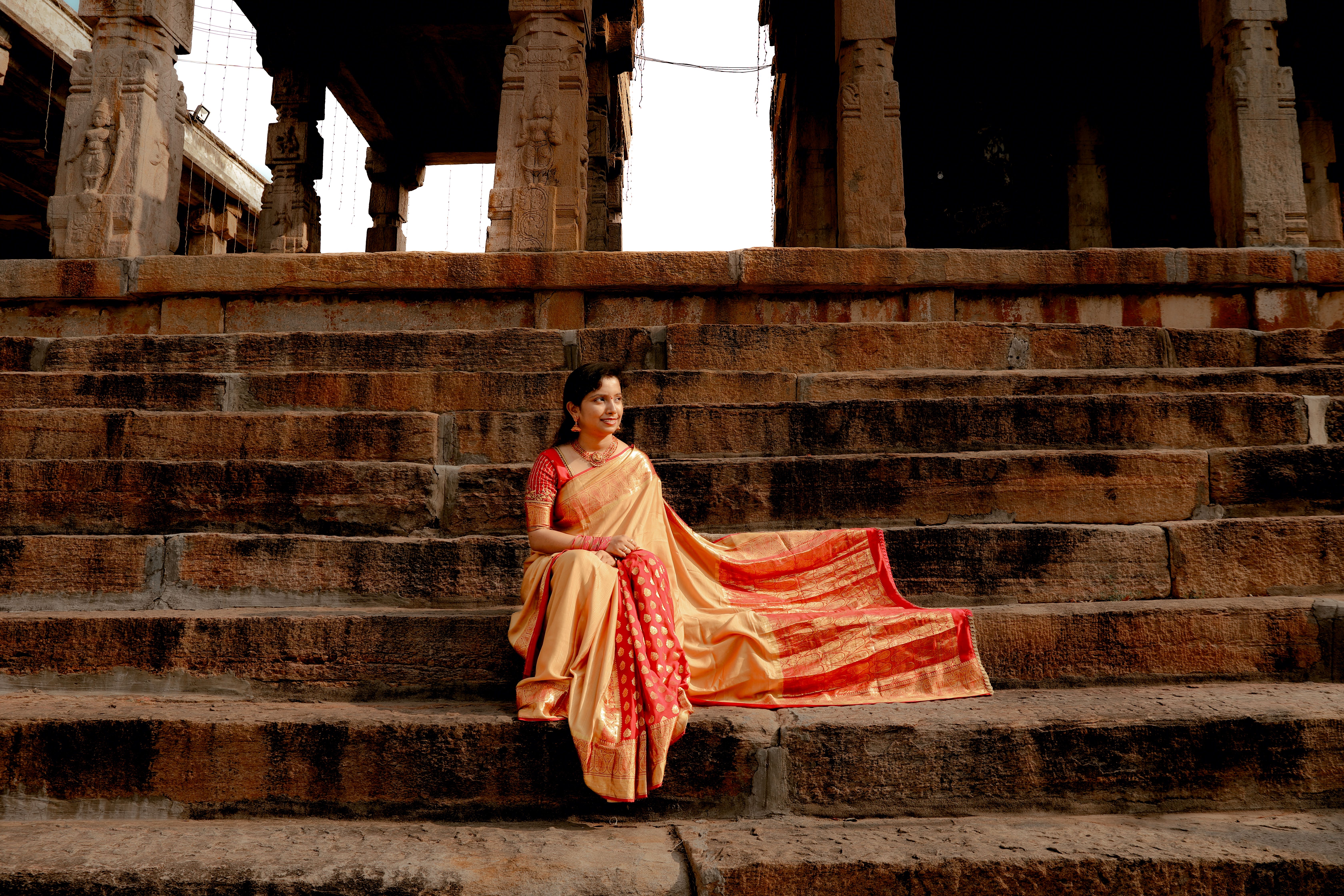 Woman in Traditional Clothing Sitting on Stairs in Temple Ruins · Free ...