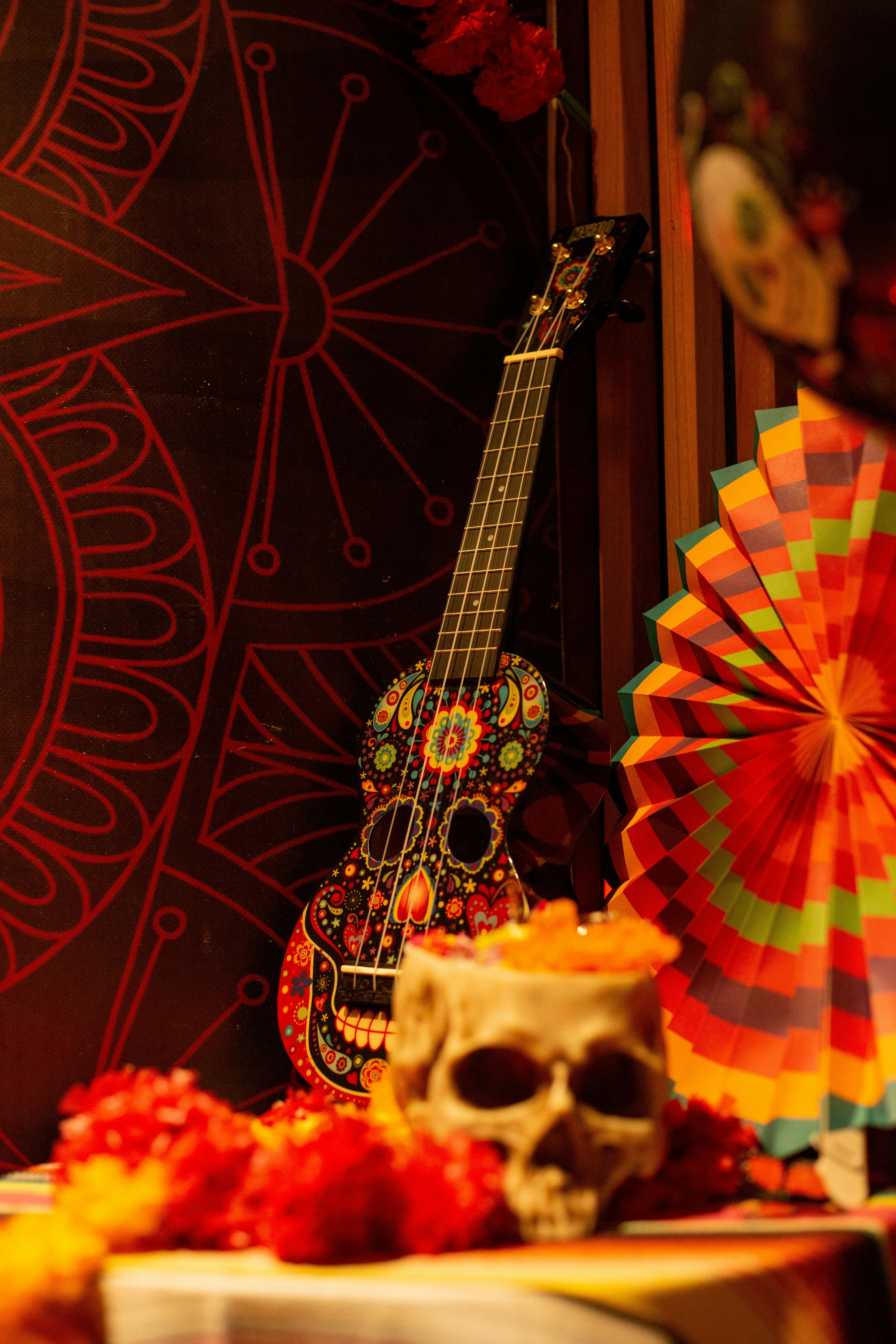 Decorative Guitar Next to Mexican Artifacts · Free Stock Photo