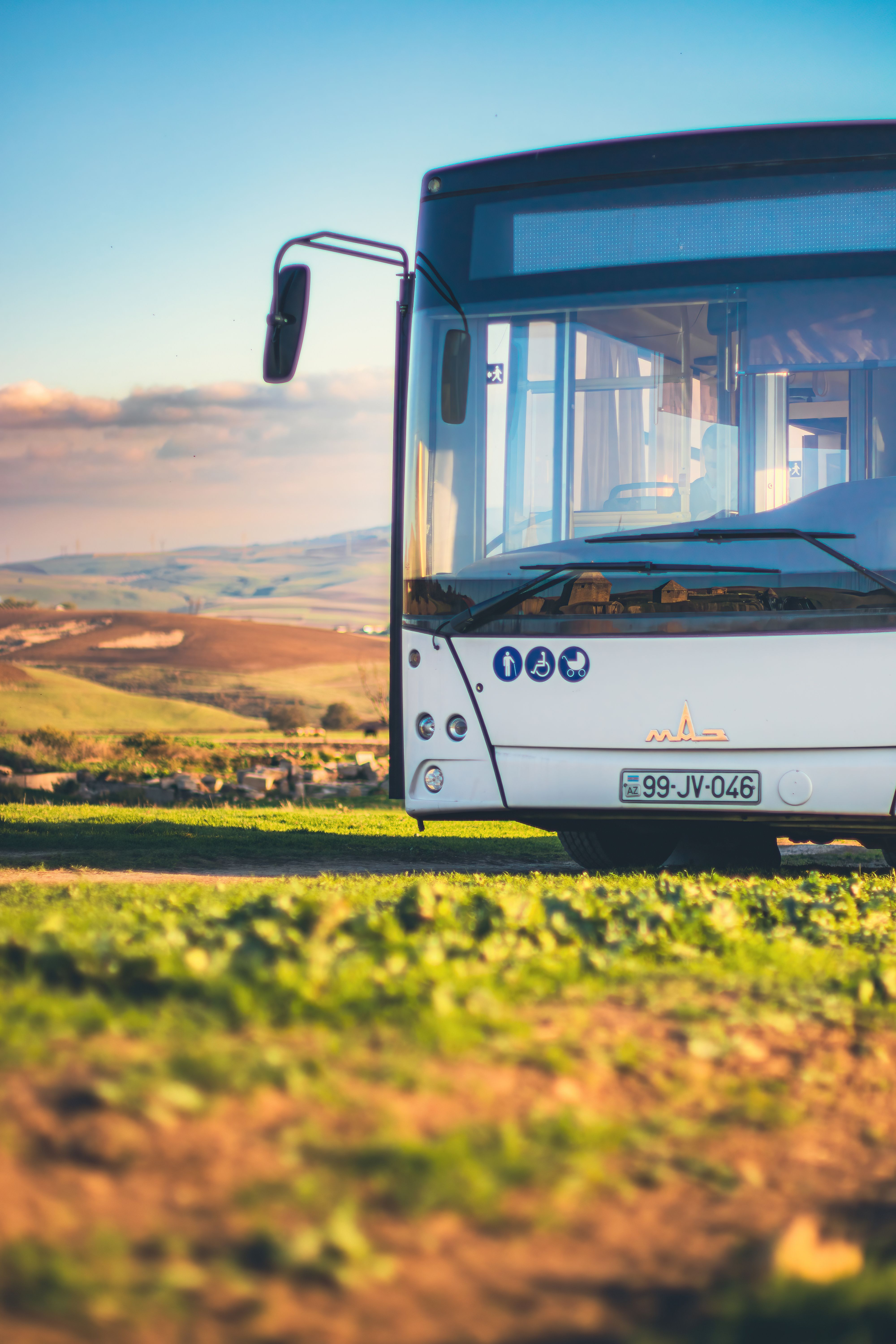 White Bus on a Field · Free Stock Photo