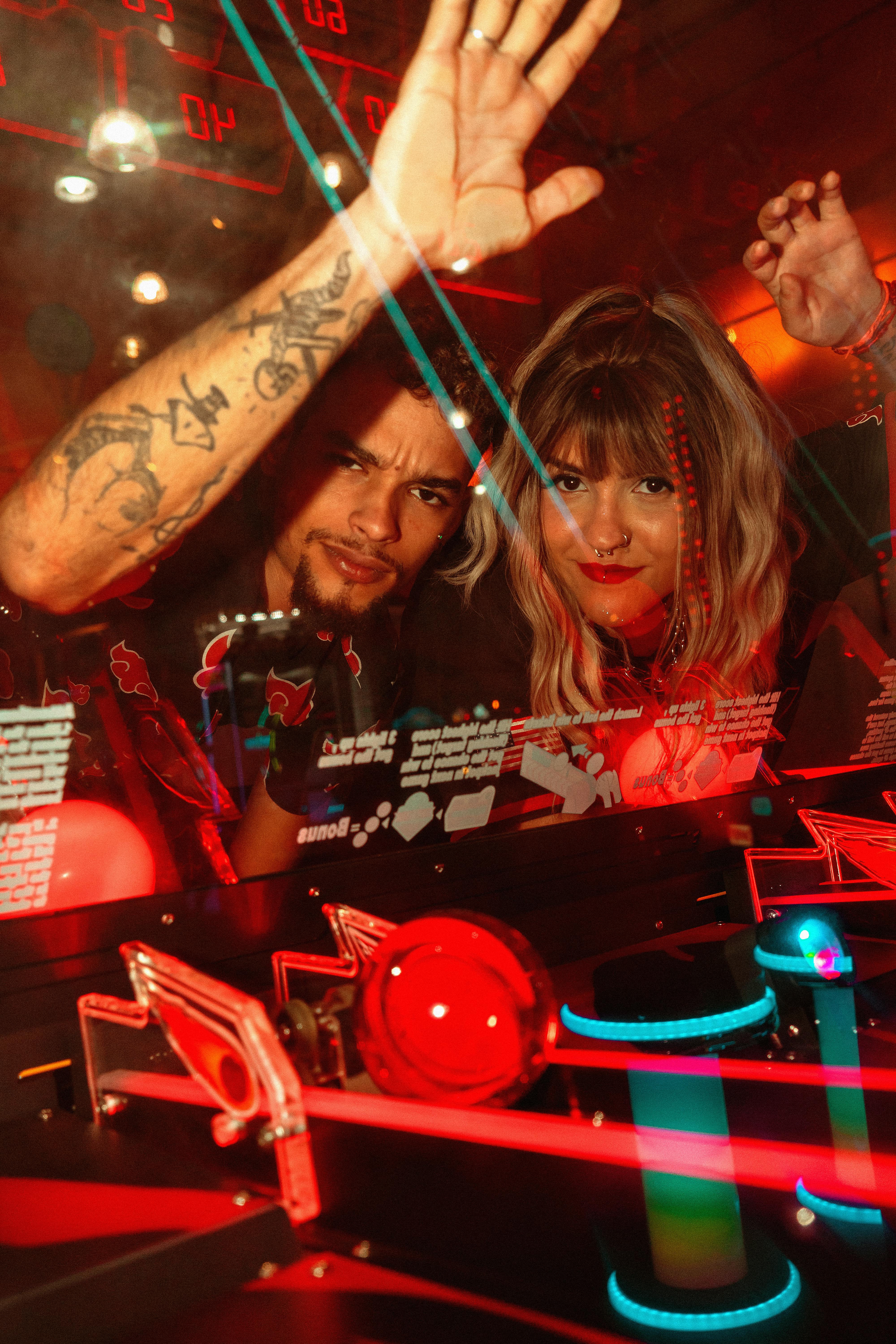 Two people are playing with a dj machine · Free Stock Photo