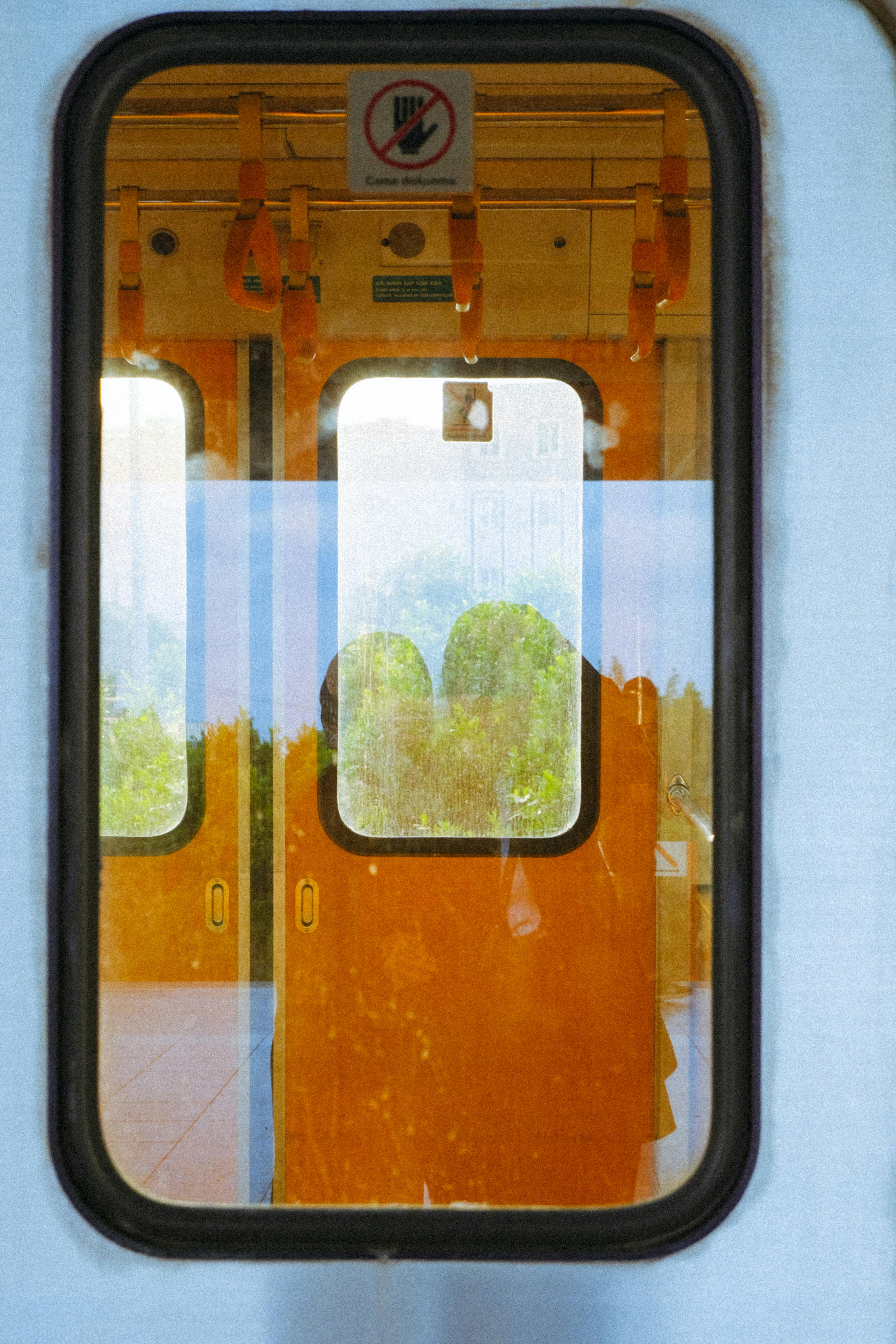 View of the Window in the Train Door · Free Stock Photo