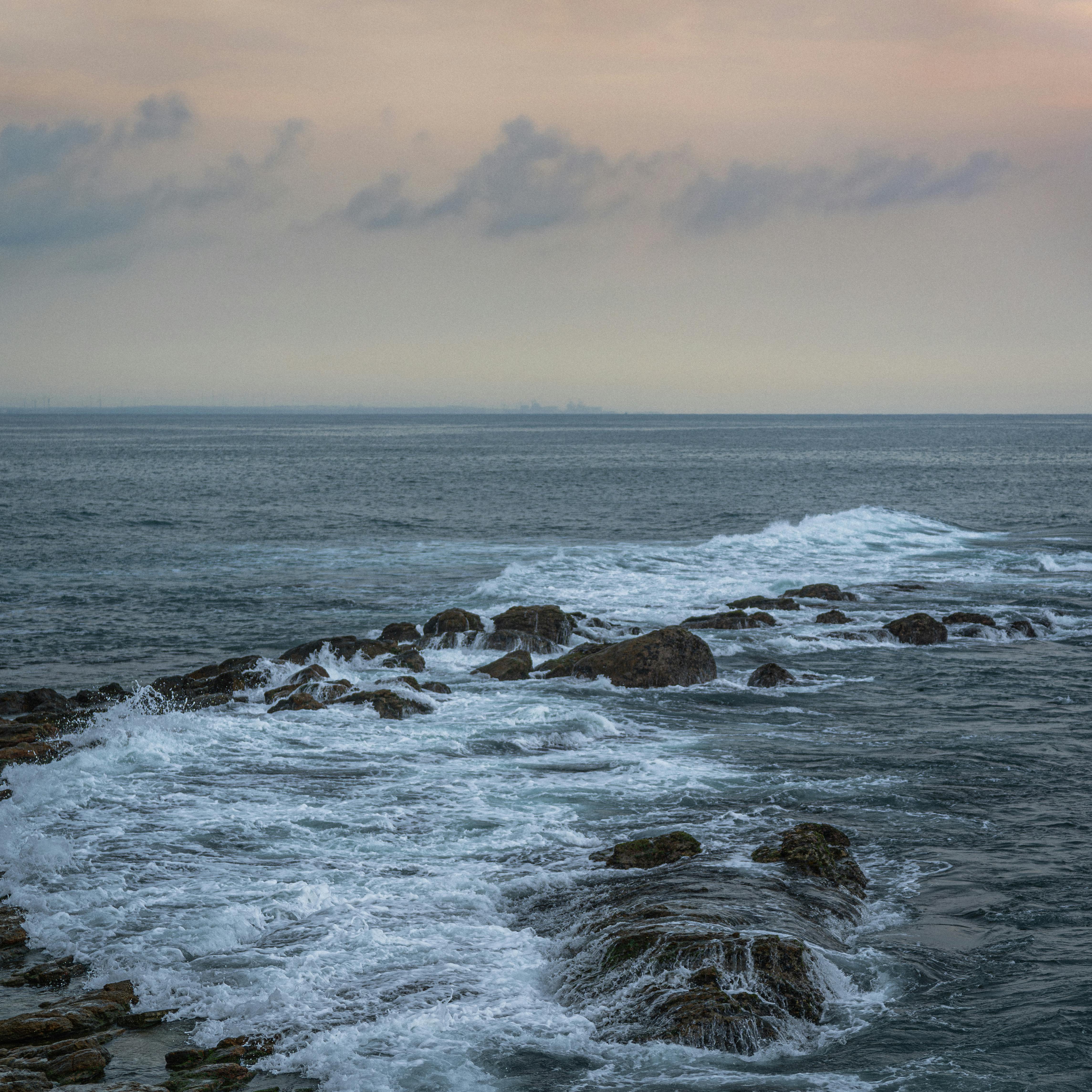 Waves Going Over Rocks in Water · Free Stock Photo